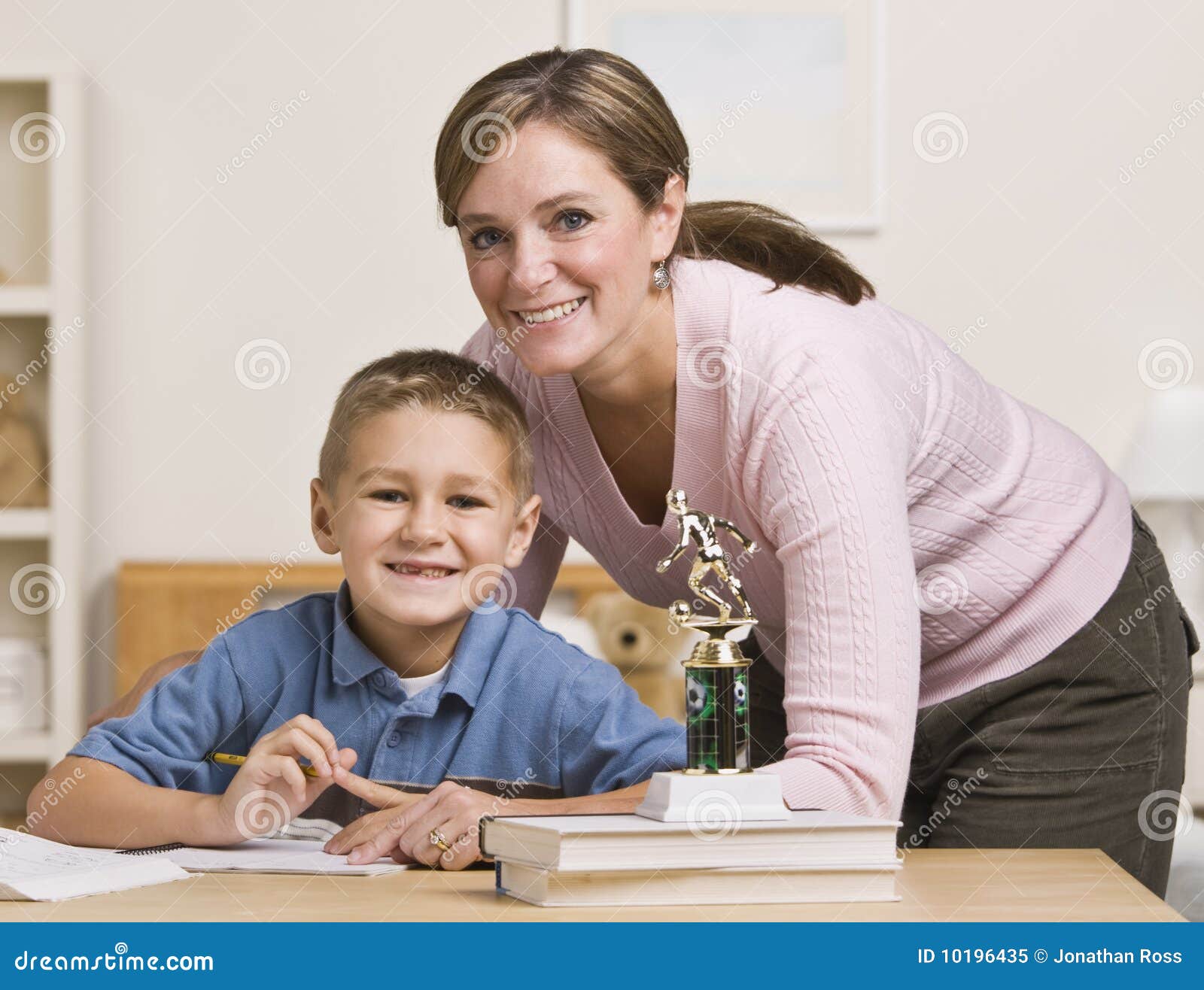 Woman Helping Son with Homework Stock Image - Image of casual, clothing ...