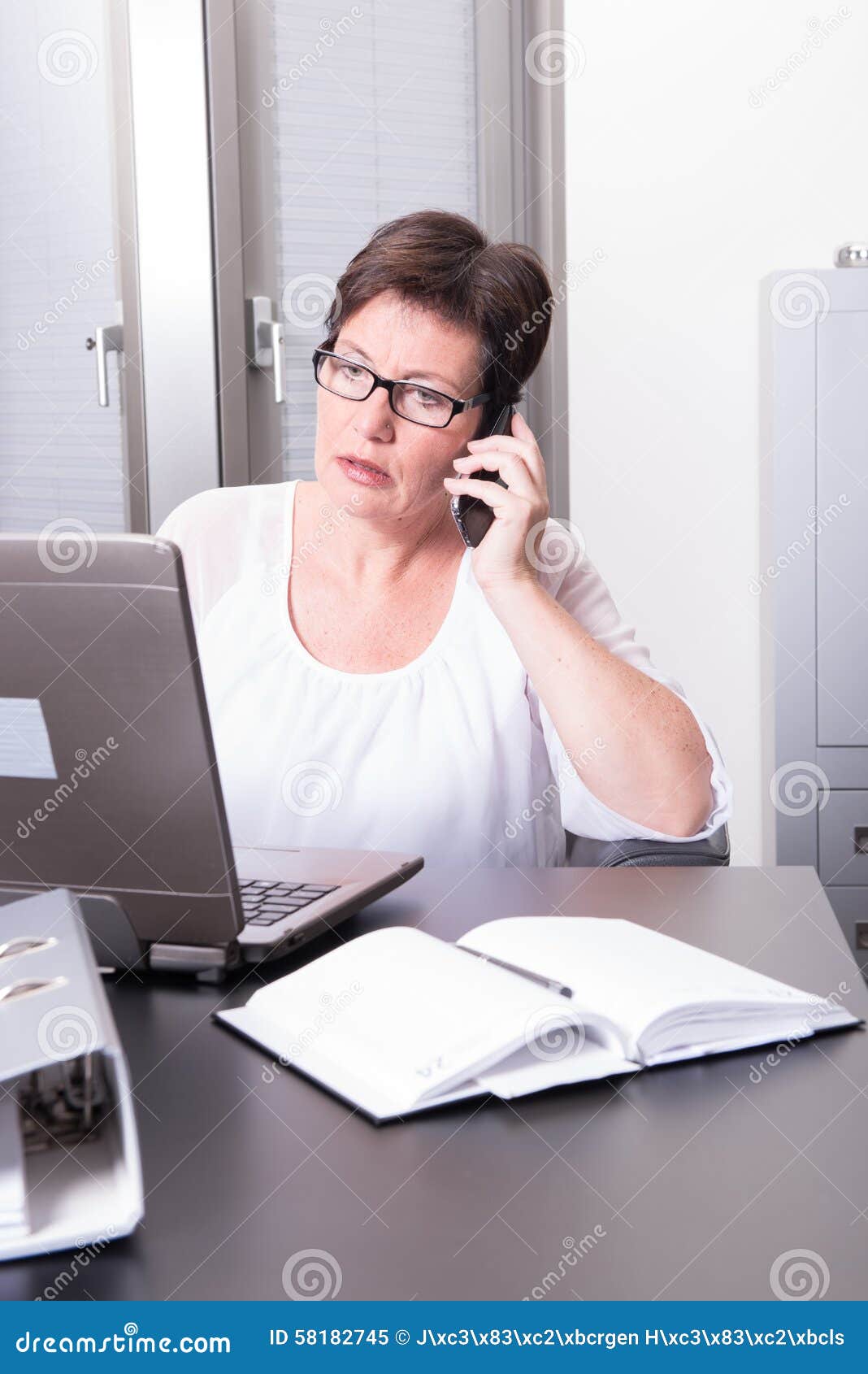 Woman In Her Homeoffice On The Phone Stock Image Image Of Laptop