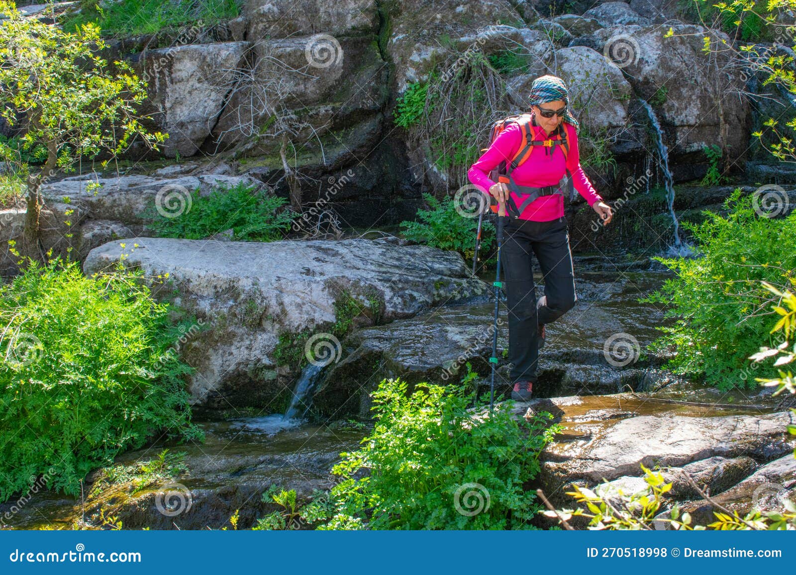 Woman Hiker Crossing a River by the Rocks Stock Photo - Image of hike ...