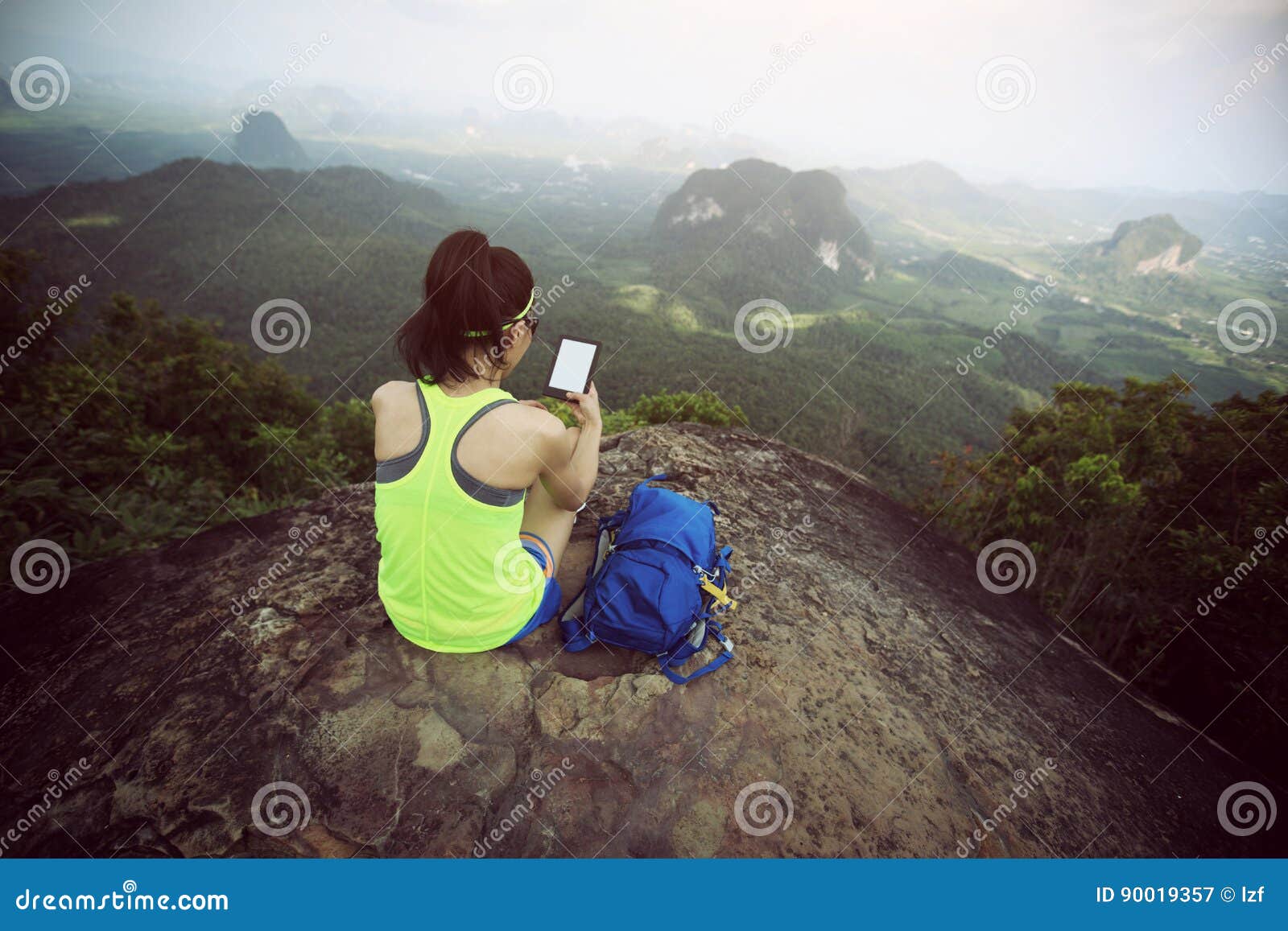 Woman Hiker Reading E-book on Mountain Top Stock Image - Image of asian ...