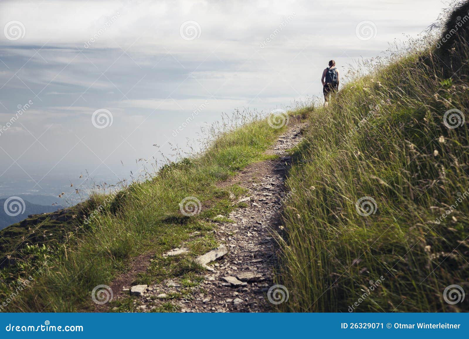 Woman on hiking path stock image. Image of cloudy, energetic - 26329071