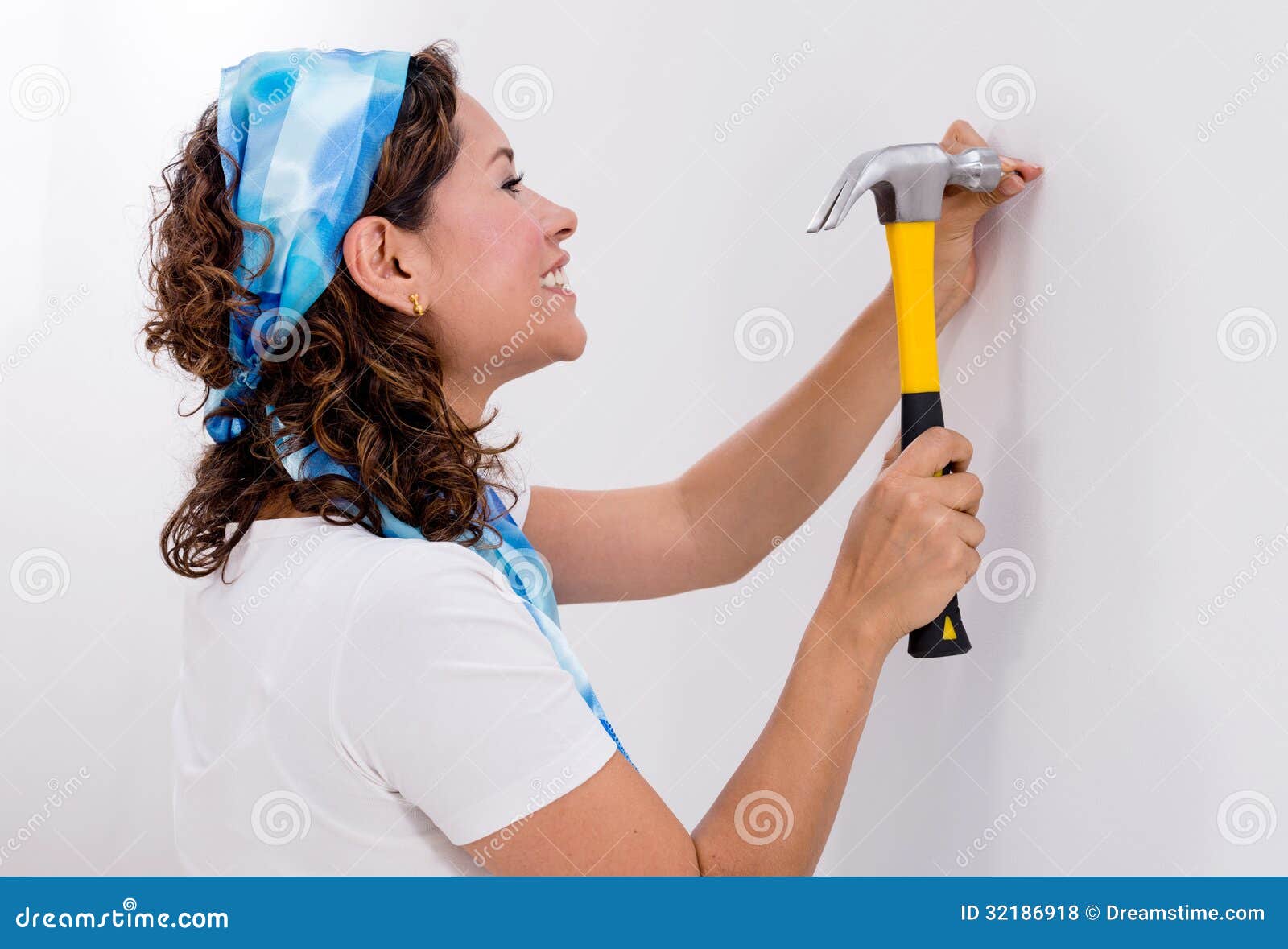 Woman hitting a nail stock photo. Image of hammer, worker - 32186918