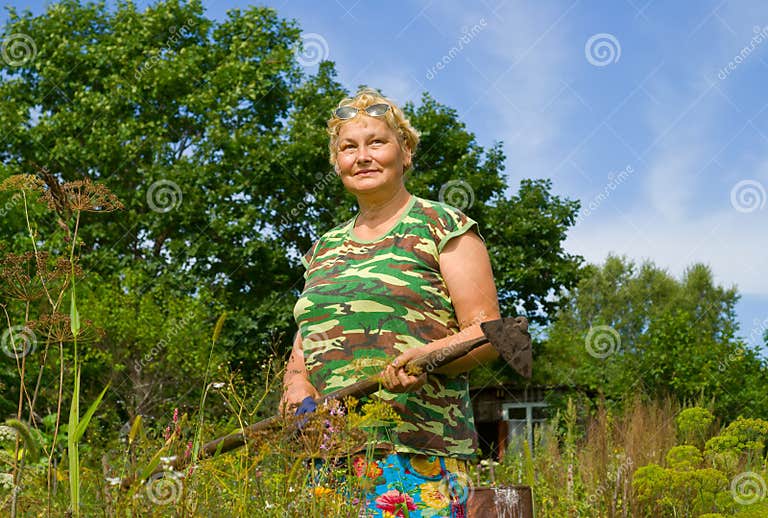Woman with hoe 4 stock photo. Image of cheerful, pulling - 21388324