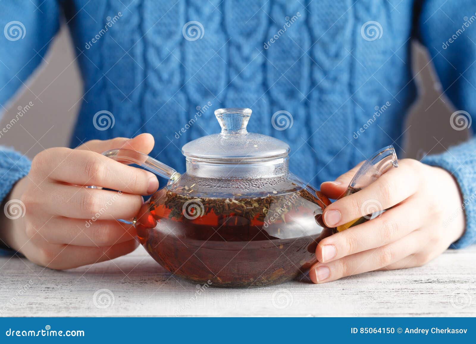 Woman hold kettle in hands stock photo. Image of elegance - 85064150