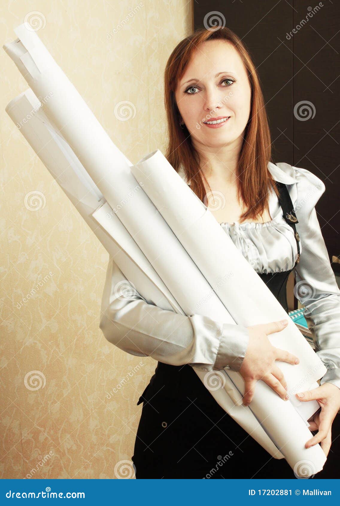 Woman holding blueprints stock image. Image of architect - 17202881