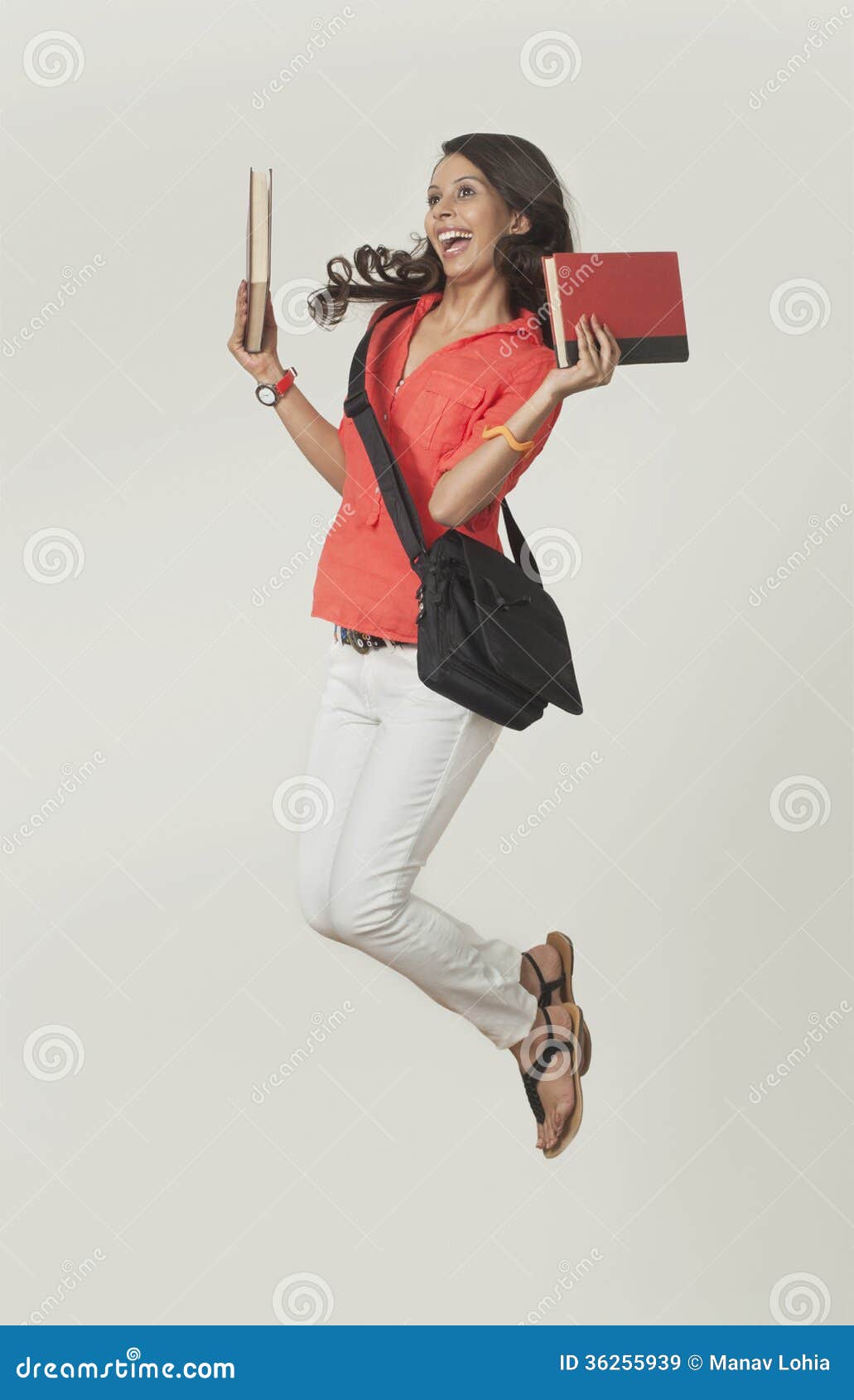 Woman Holding Books and Jumping Stock Image - Image of midair, jumping ...