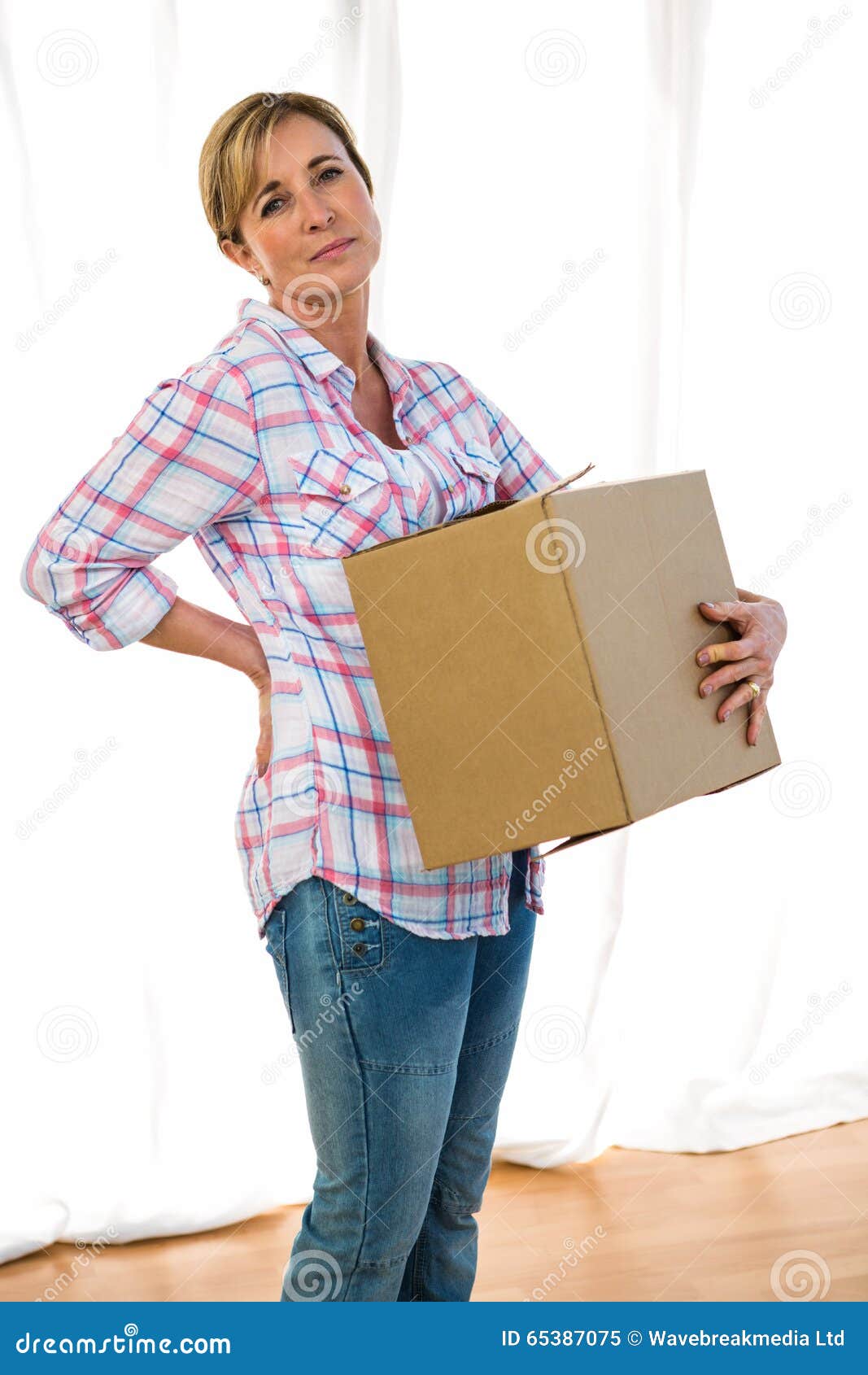 Woman holding a box stock image. Image of homey, hurt - 65387075
