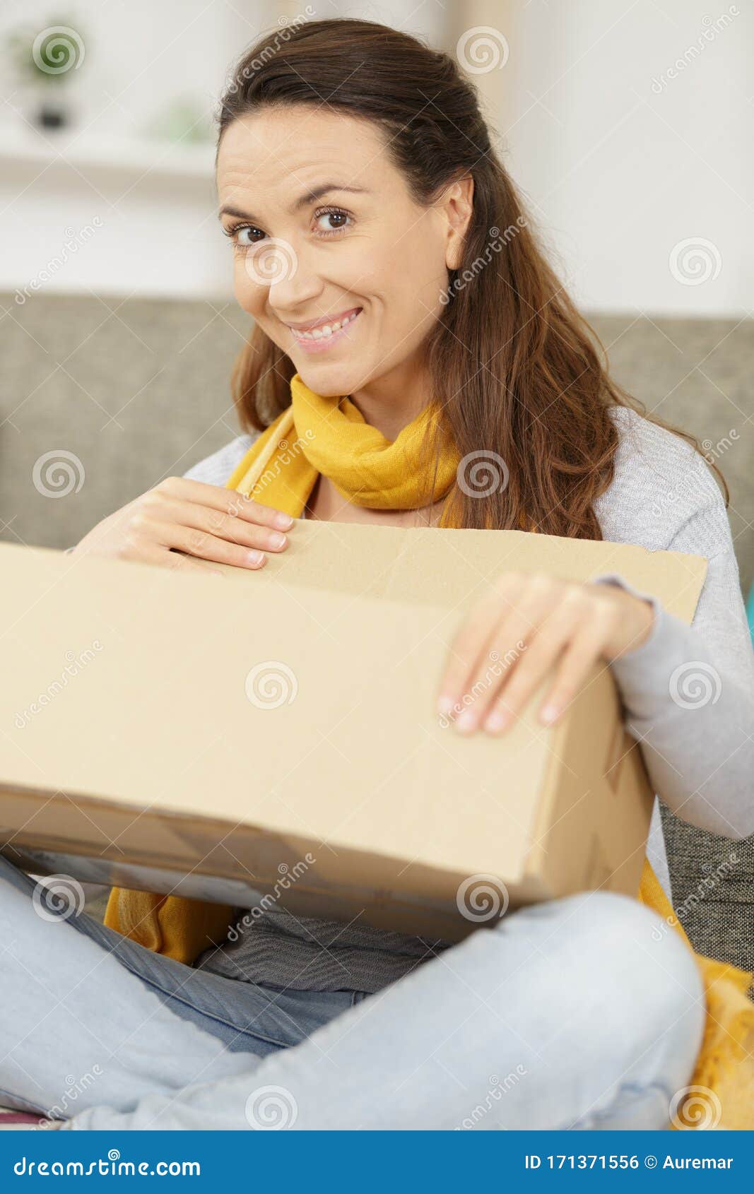 Woman holding box smiling stock photo. Image of carton - 171371556