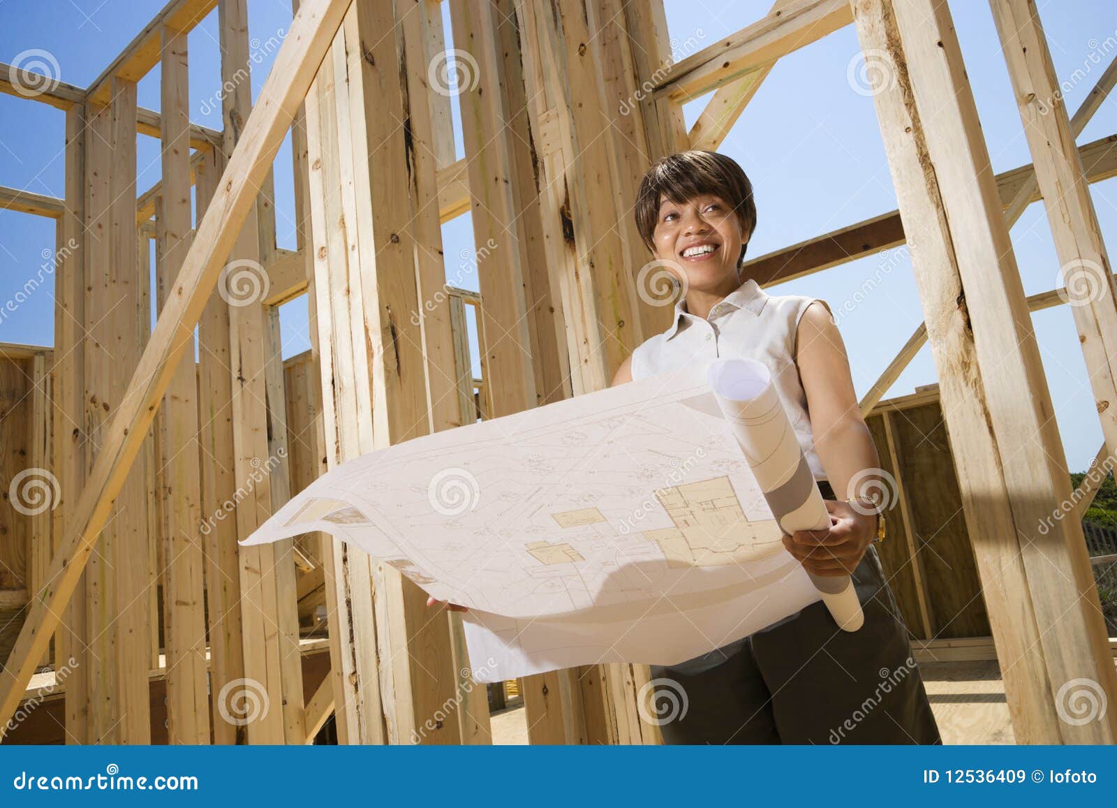 Woman Holding Building Plans Stock Image - Image of forties, fifties ... Woman Holding Building Plans Stock Image - Image of forties, fifties ...
