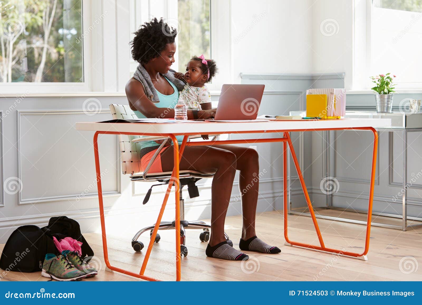 Woman Holding Child Using Computer at Home after Exercising Stock Image ...
