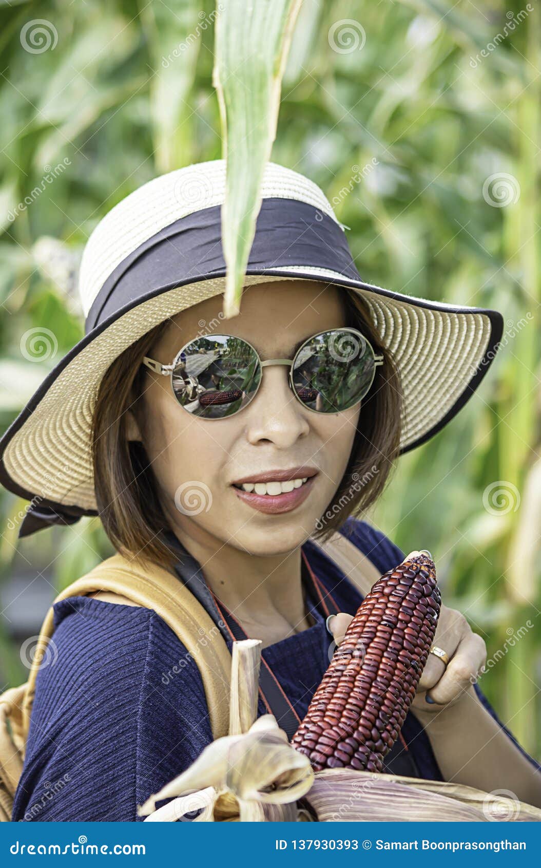A Woman Holding the Corn at the Show in the Farm Stock Image - Image of ...
