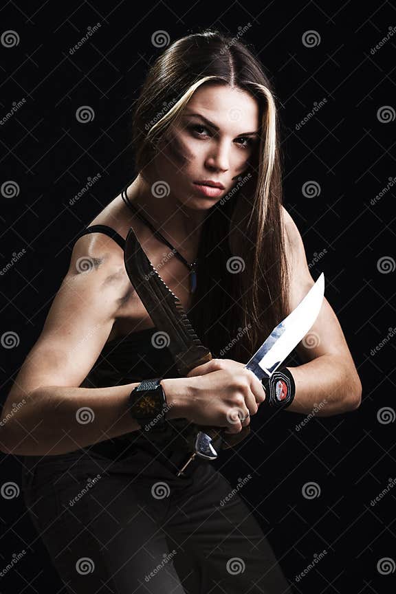 Woman holding dagger stock image. Image of bodyguard - 23936417