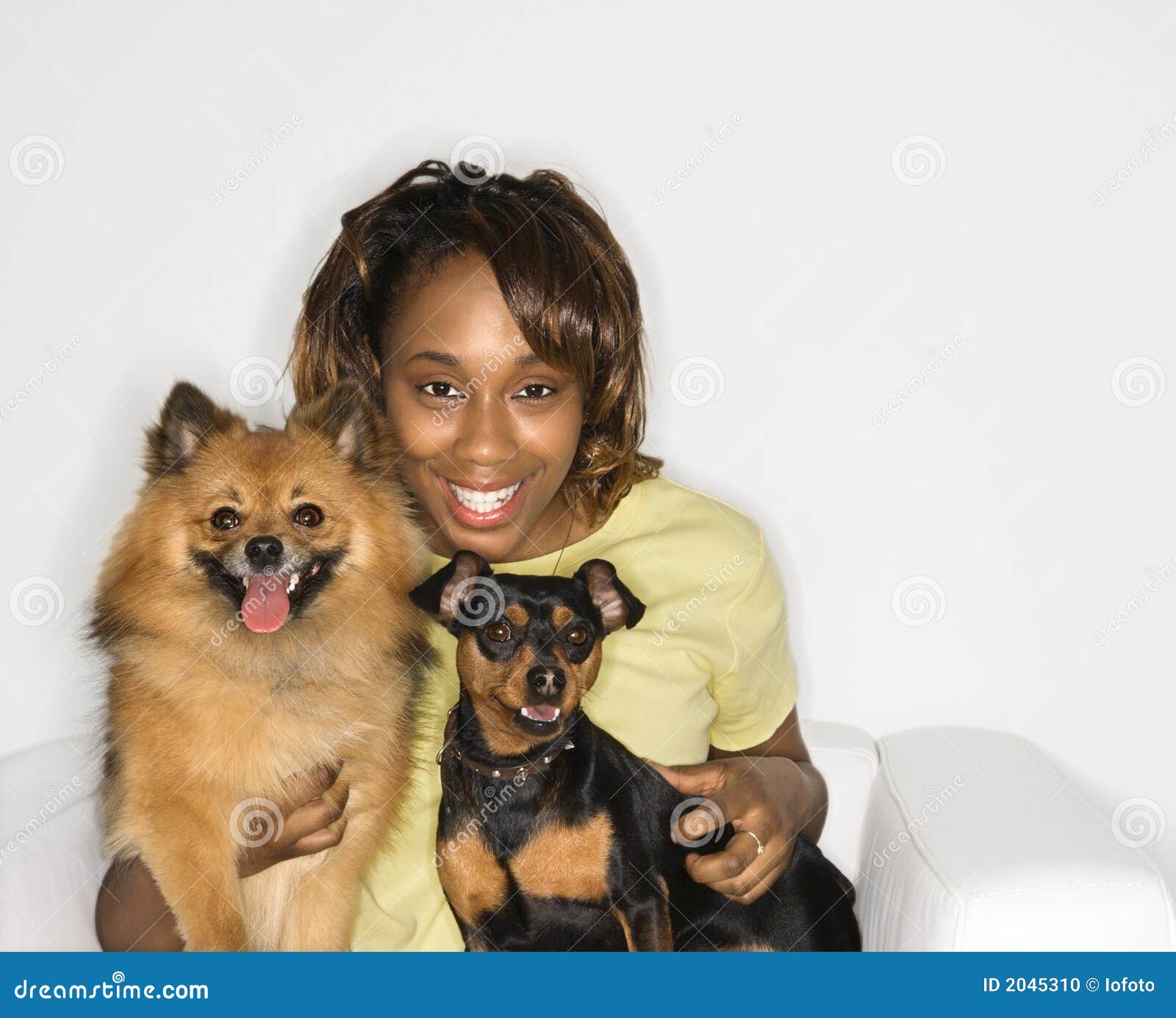 Woman holding dogs. stock photo. Image of woman, african - 2045310