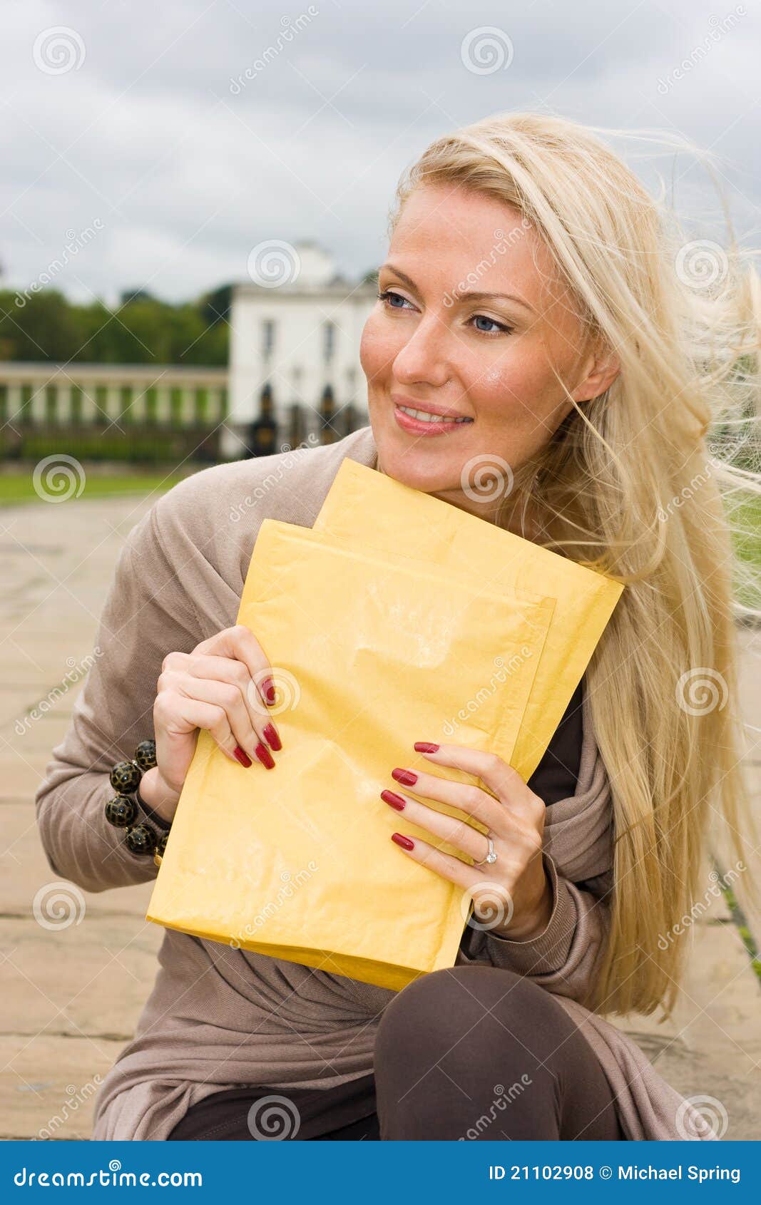 Woman holding envelopes stock photo. Image of beauty - 21102908