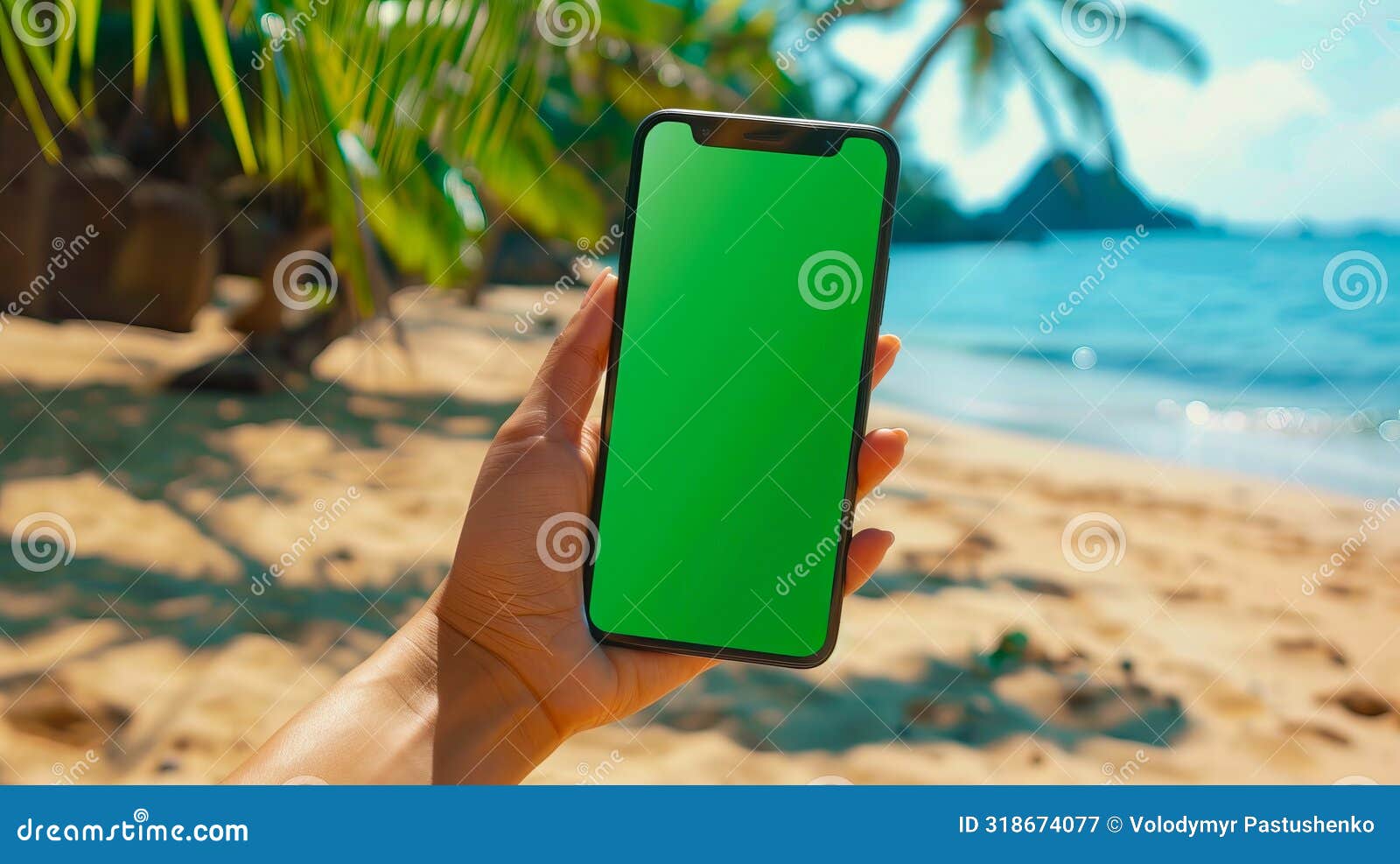 A Woman Holding a Green Screen Phone on the Beach Stock Image - Image ...