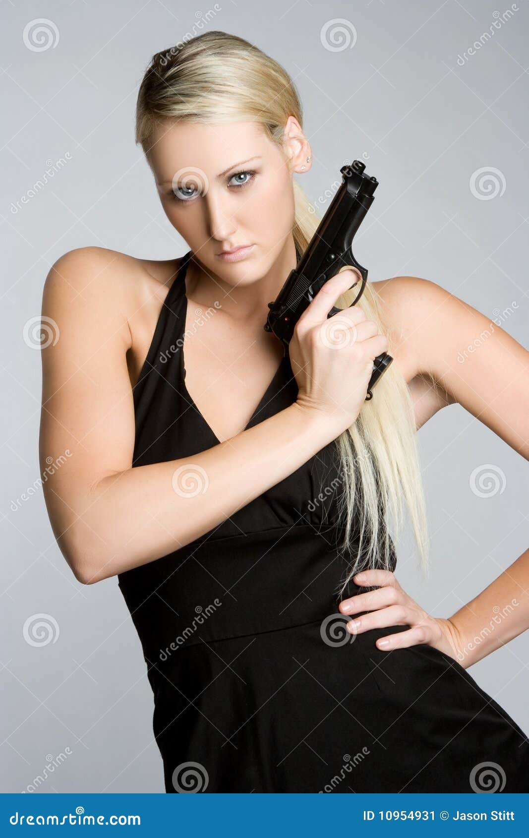 Woman Holding Gun stock image. Image of face, guns, blonde - 10954931