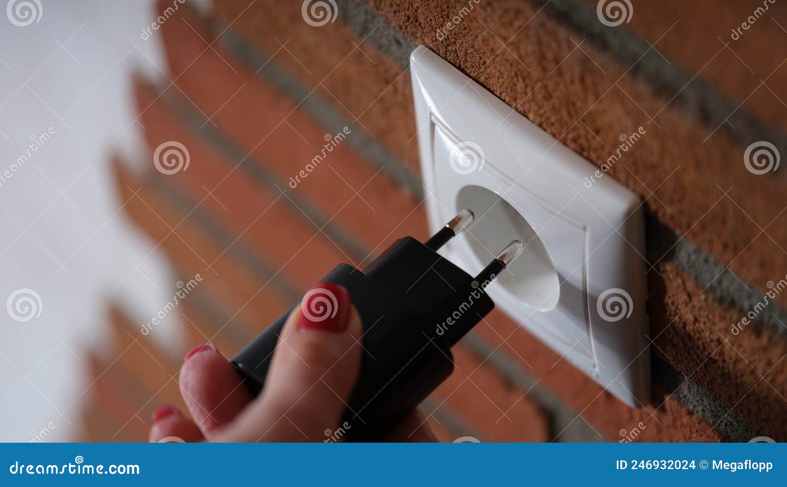 Woman Holding Hand and Inserting Plug into Socket Closeup Stock Photo ...