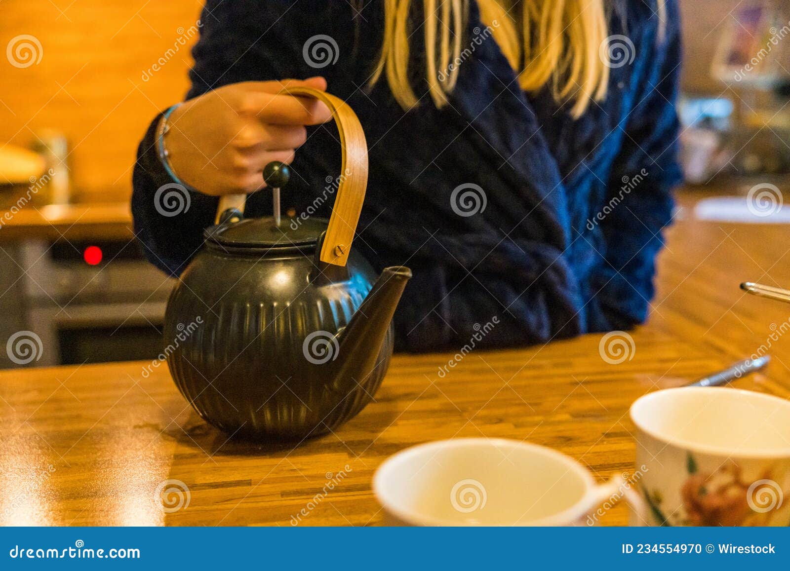 Woman Holding the Handle of a Tea Kettle Stock Photo - Image of holding ...