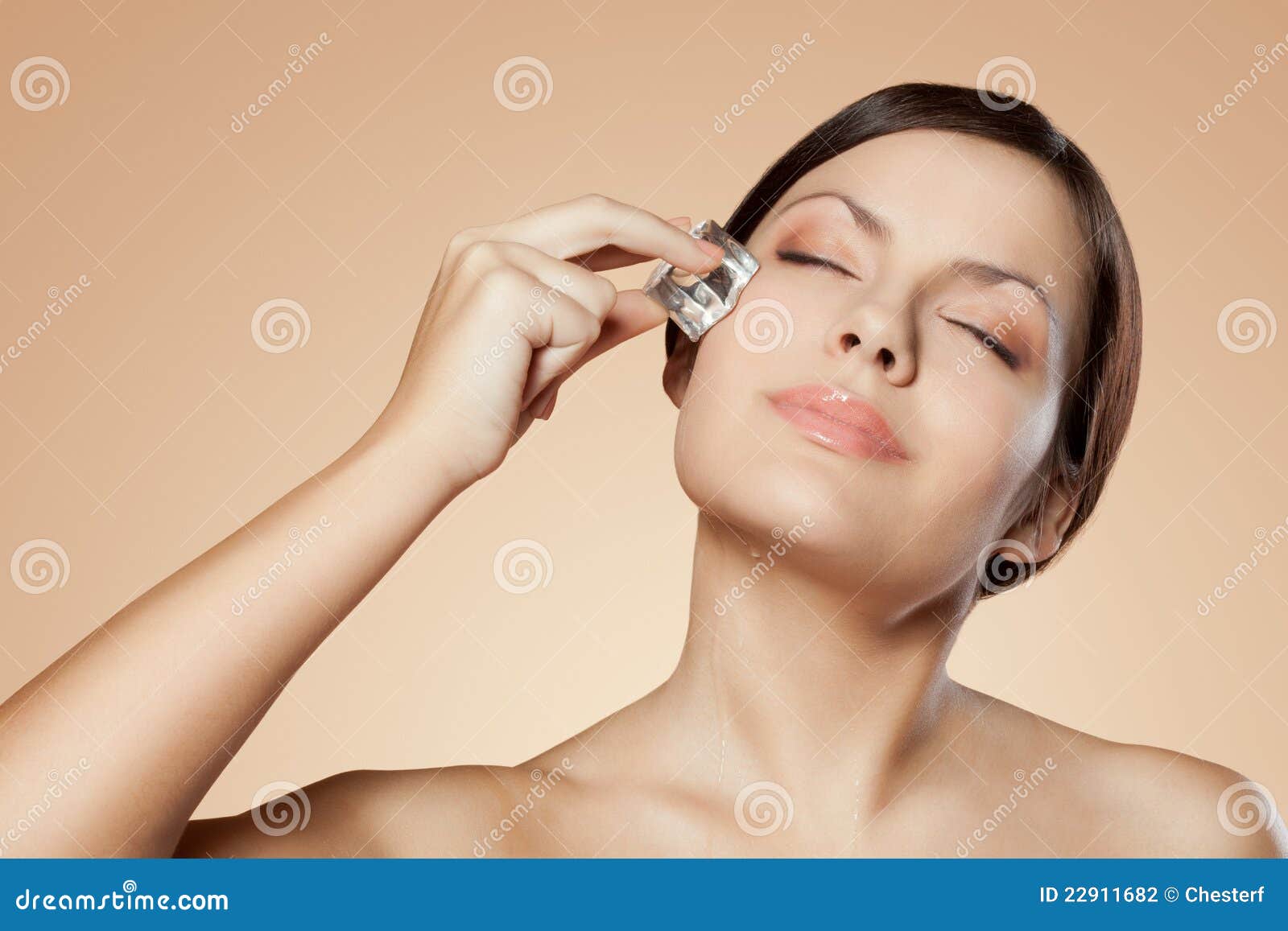 Woman Holding Ice Cube on Her Face Stock Photo - Image of healthy, cube ...