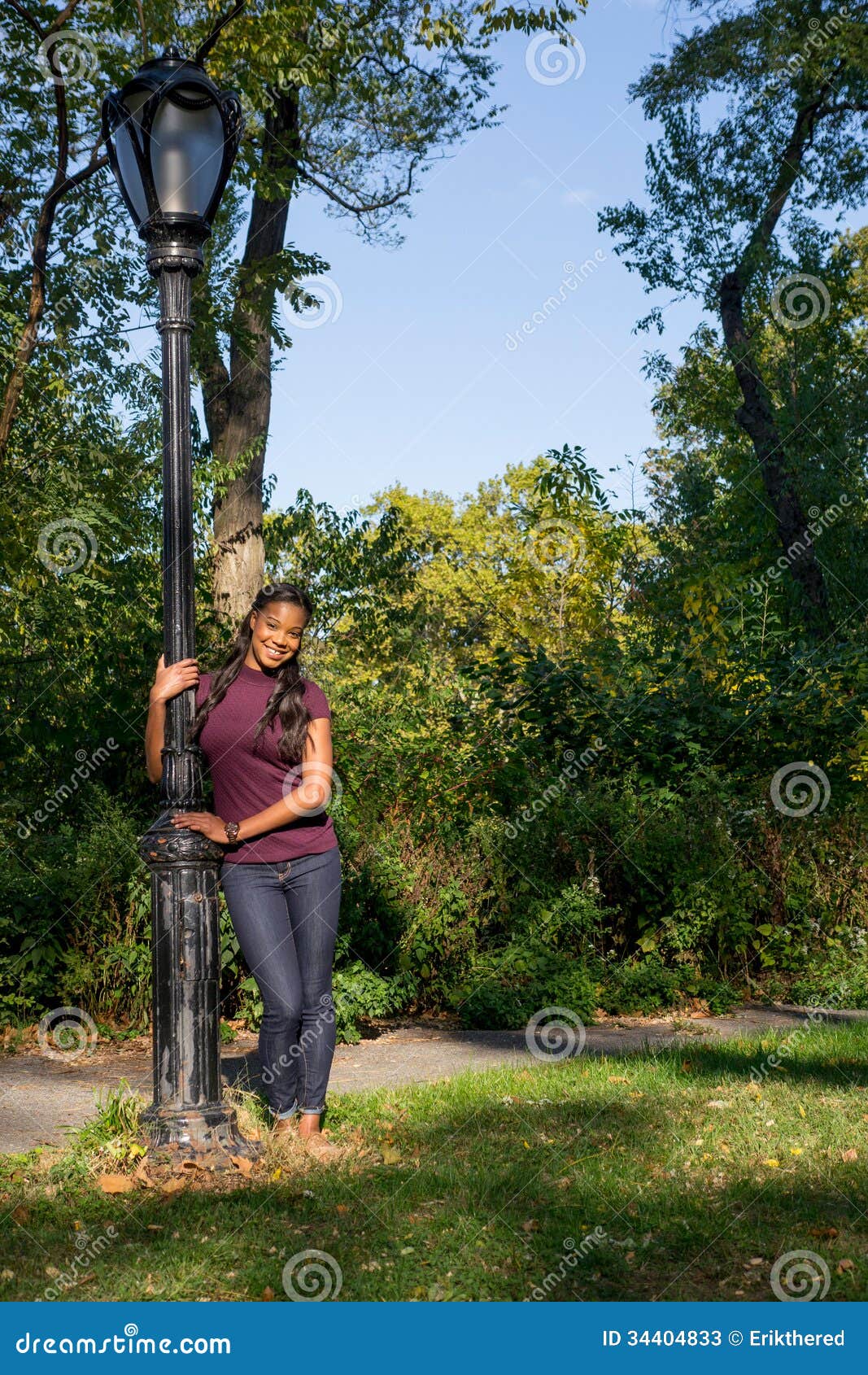 Woman holding lamp post stock image. Image of sweater - 34404833