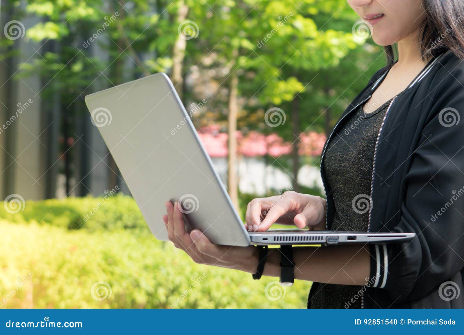 A Woman is Holding Laptop Computer To Surfing Internet Stock Photo ...