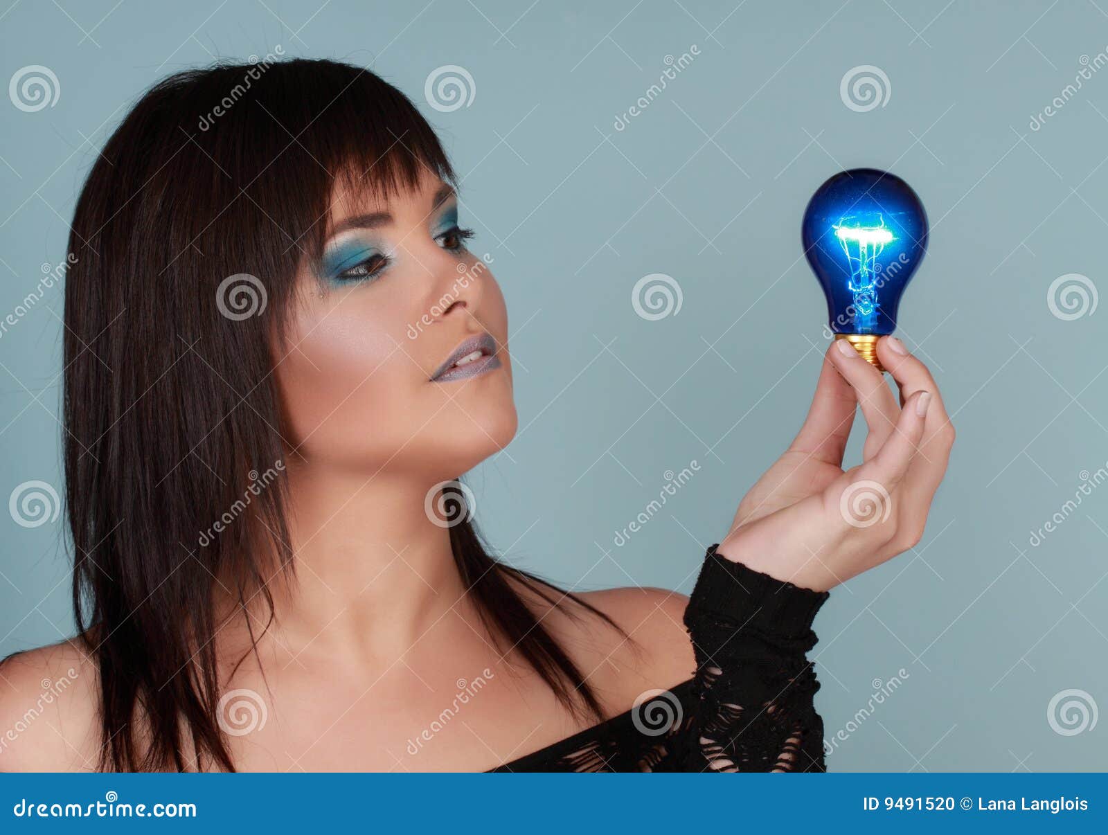 Woman holding light bulb stock photo. Image of hand, cute - 9491520