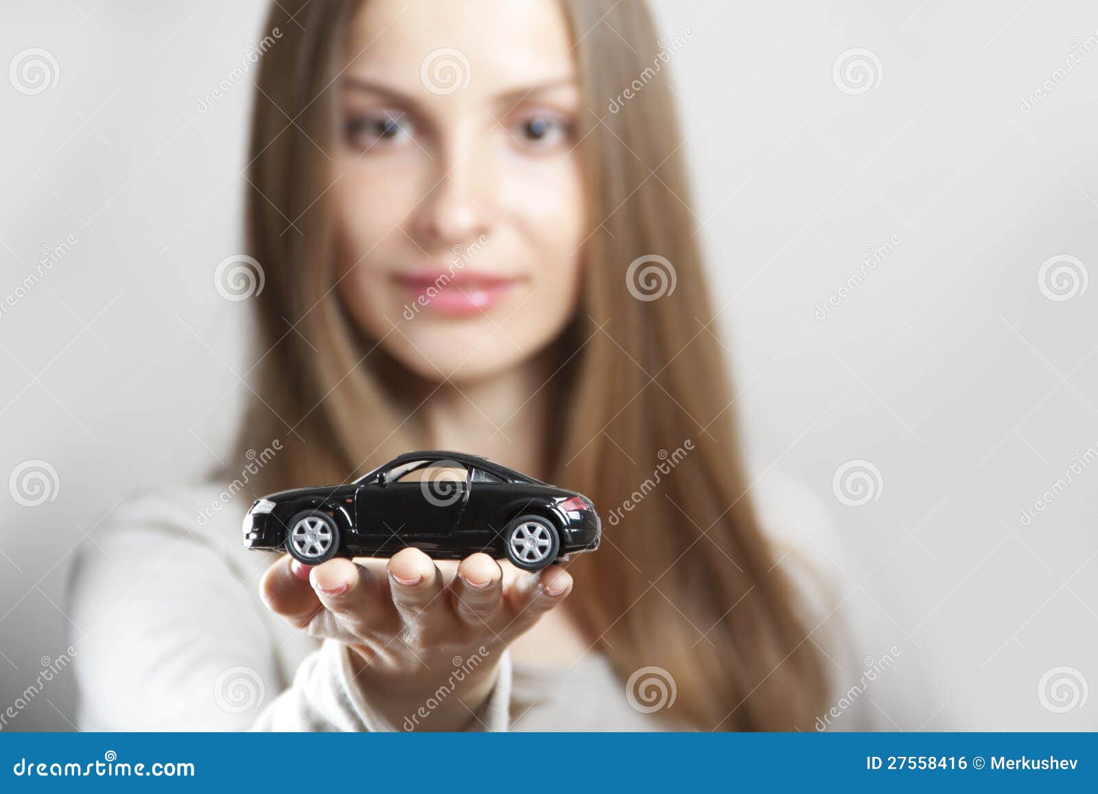 Woman holding little car stock photo. Image of security - 27558416