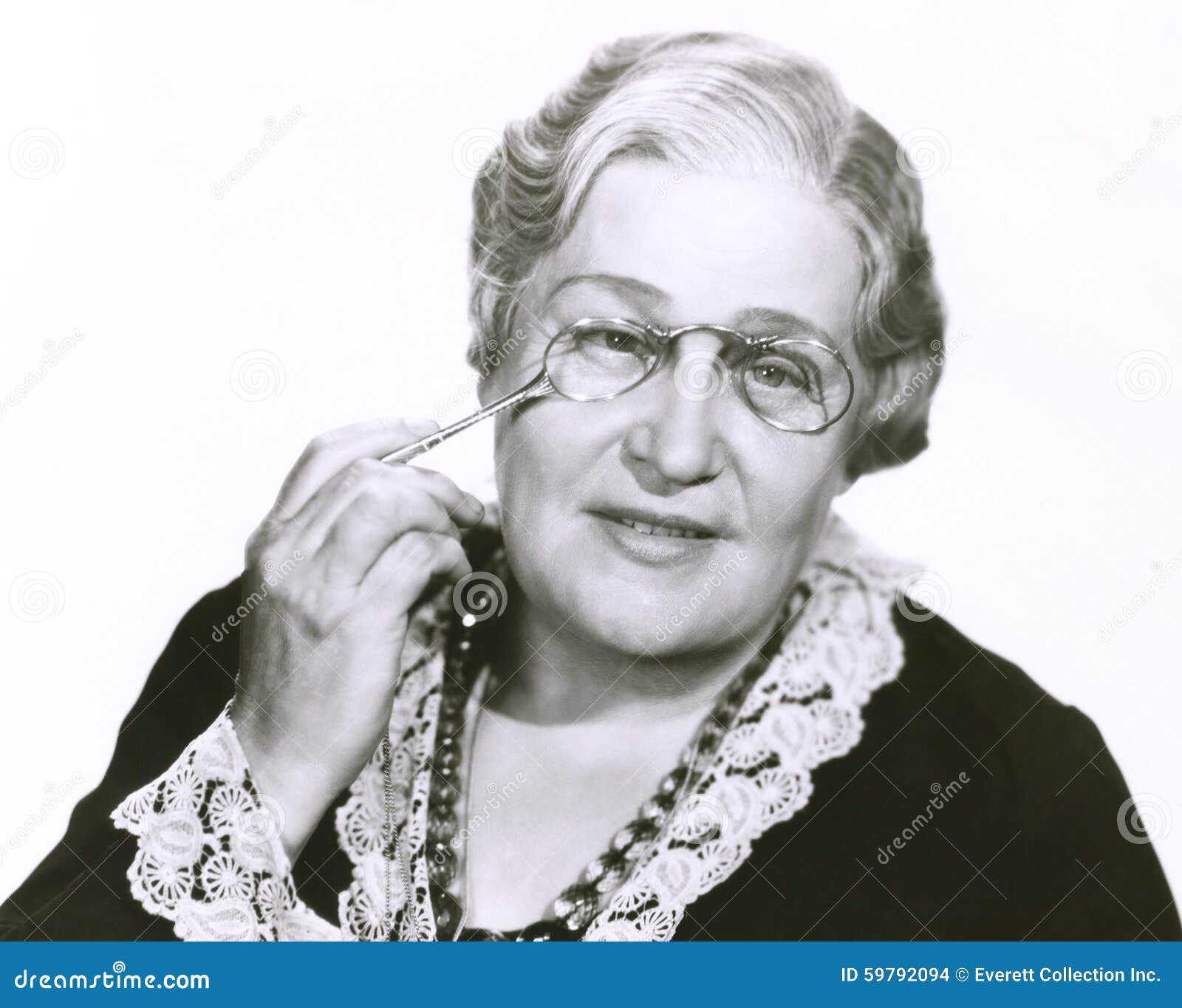 Woman holding lorgnette stock photo. Image of camera - 59792094