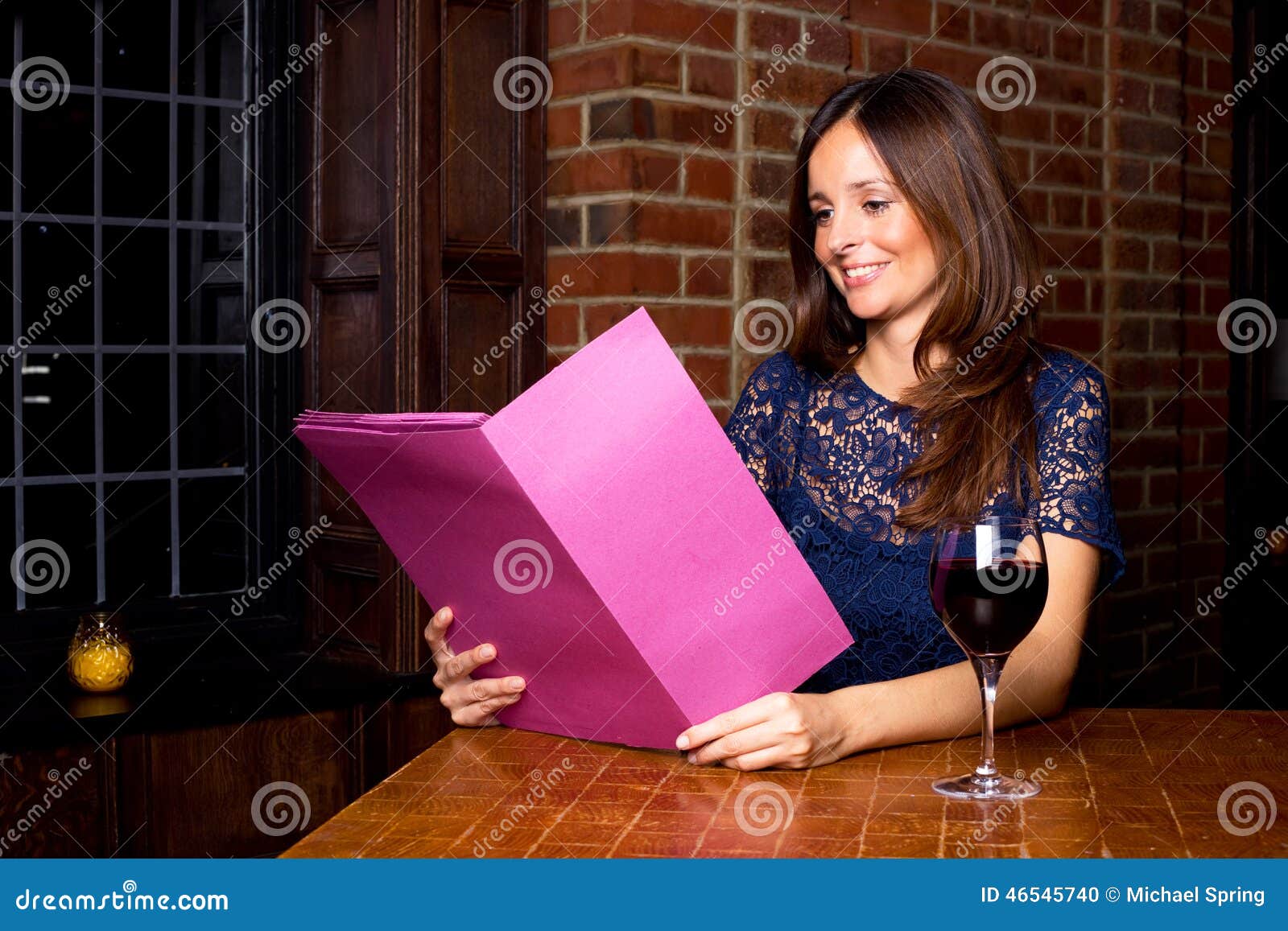 Woman holding a menu stock photo. Image of cute, happiness - 46545740