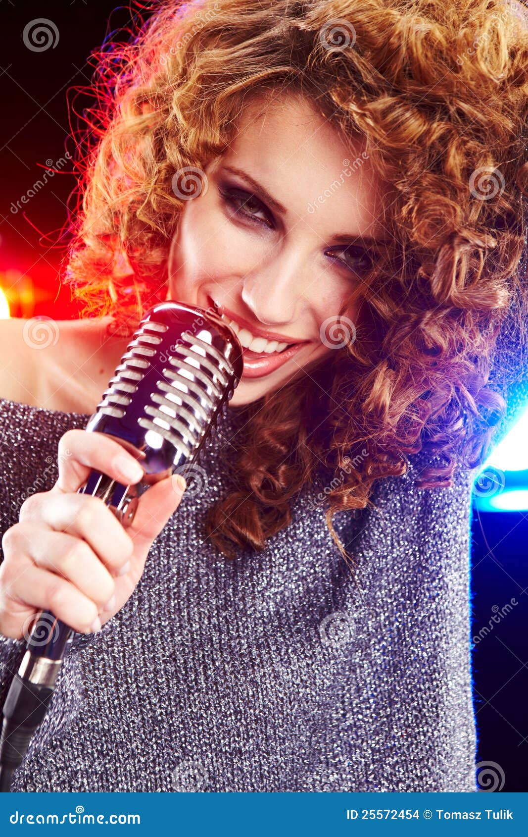 Woman holding microphone stock photo. Image of beauty - 25572454