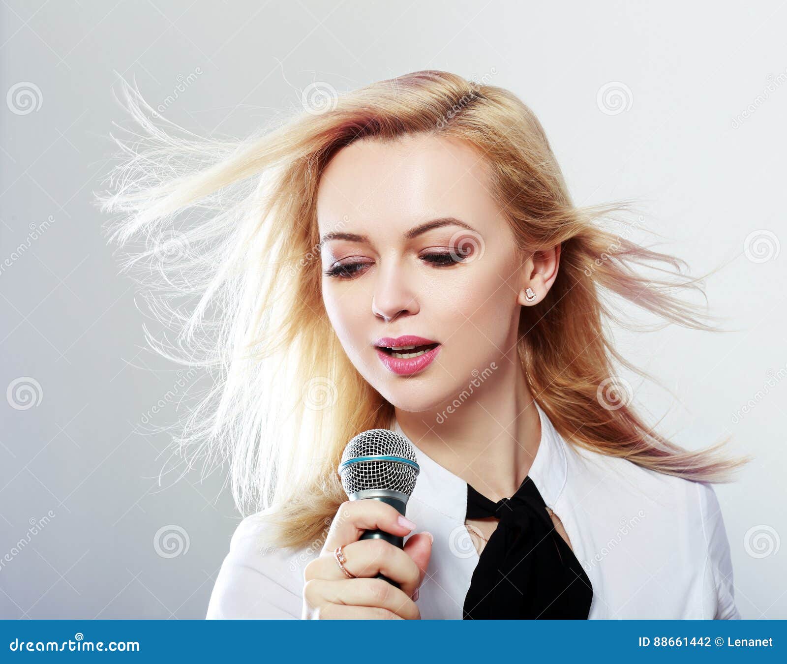 Woman holding microphone stock photo. Image of beautiful - 88661442