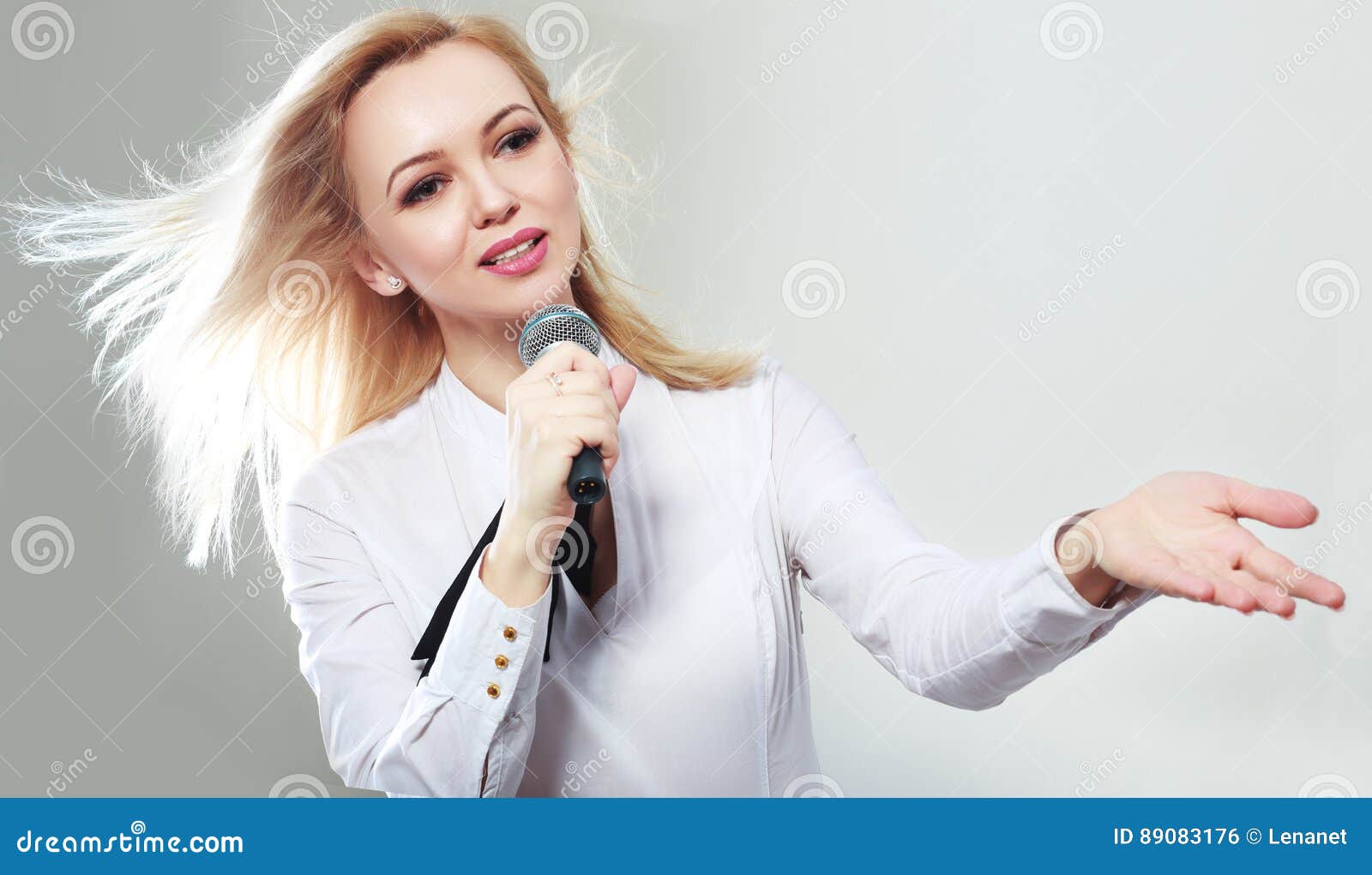 Woman holding microphone stock photo. Image of pretty - 89083176