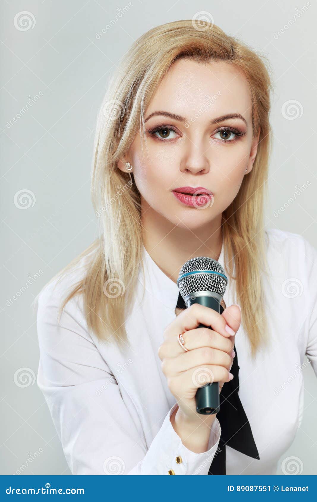 Woman holding microphone stock image. Image of interviews - 89087551