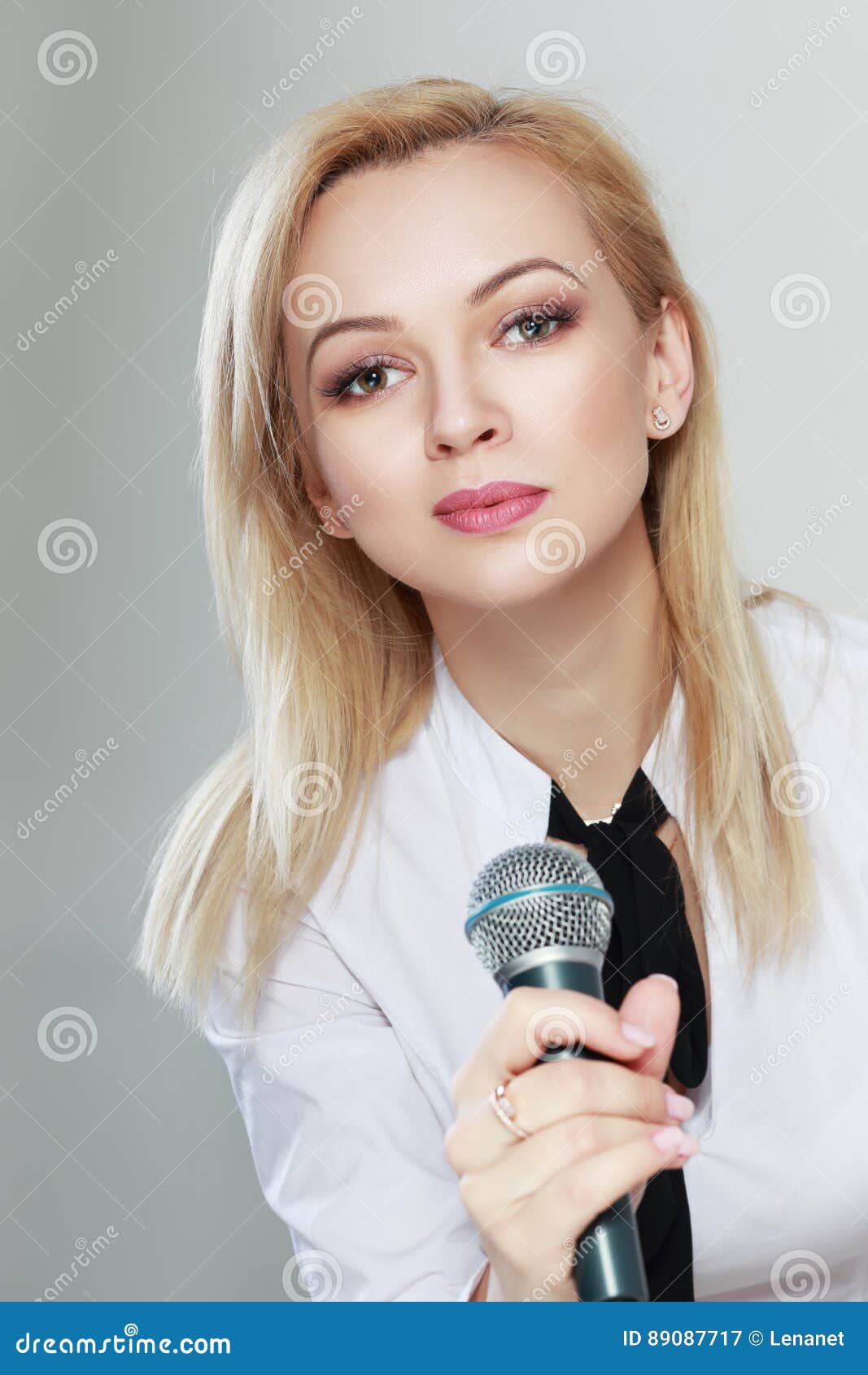 Woman holding microphone stock image. Image of interview - 89087717