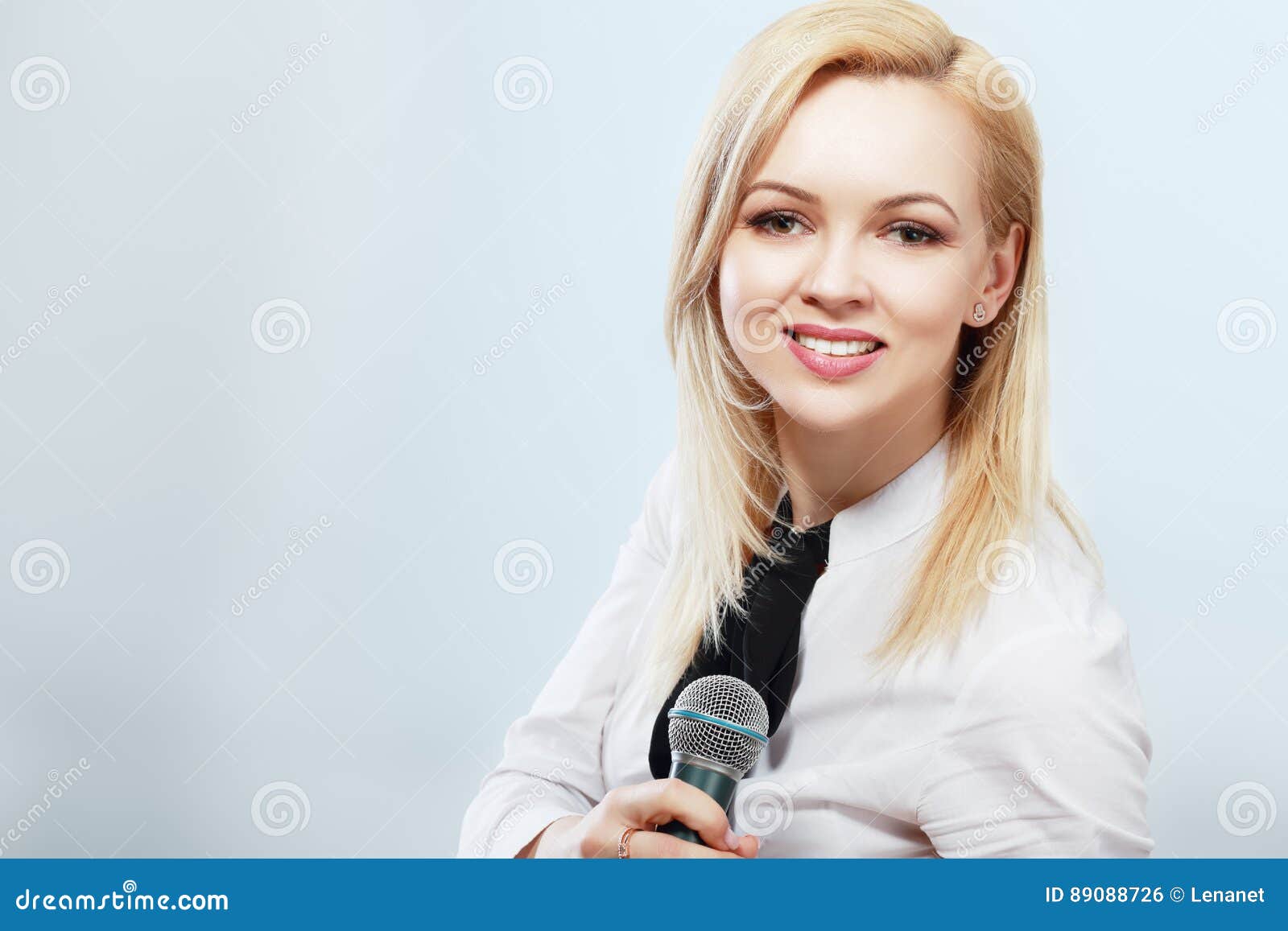 Woman holding microphone stock photo. Image of media - 89088726