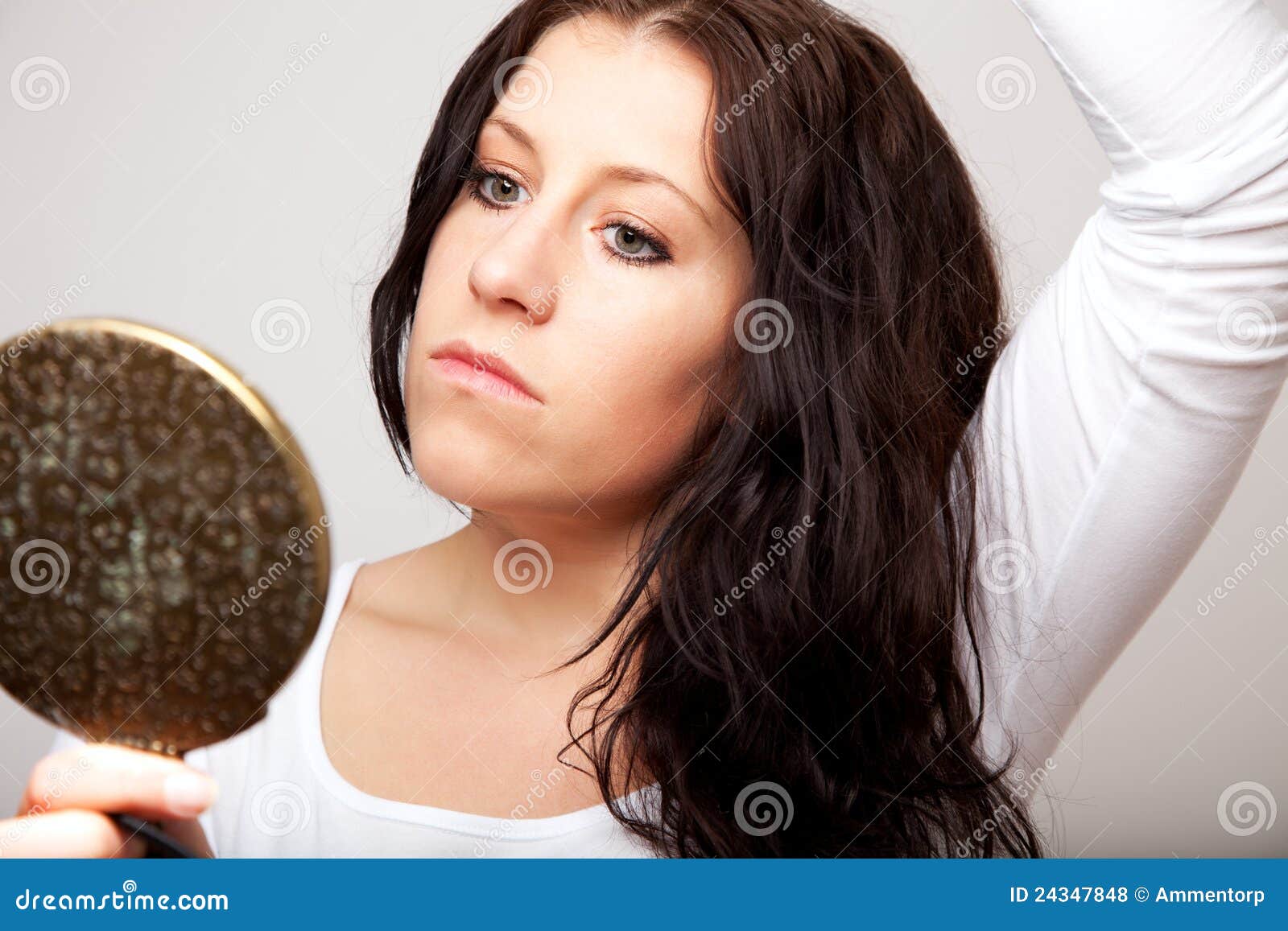 A Woman Holding a Mirror stock photo. Image of hand, grooming - 24347848