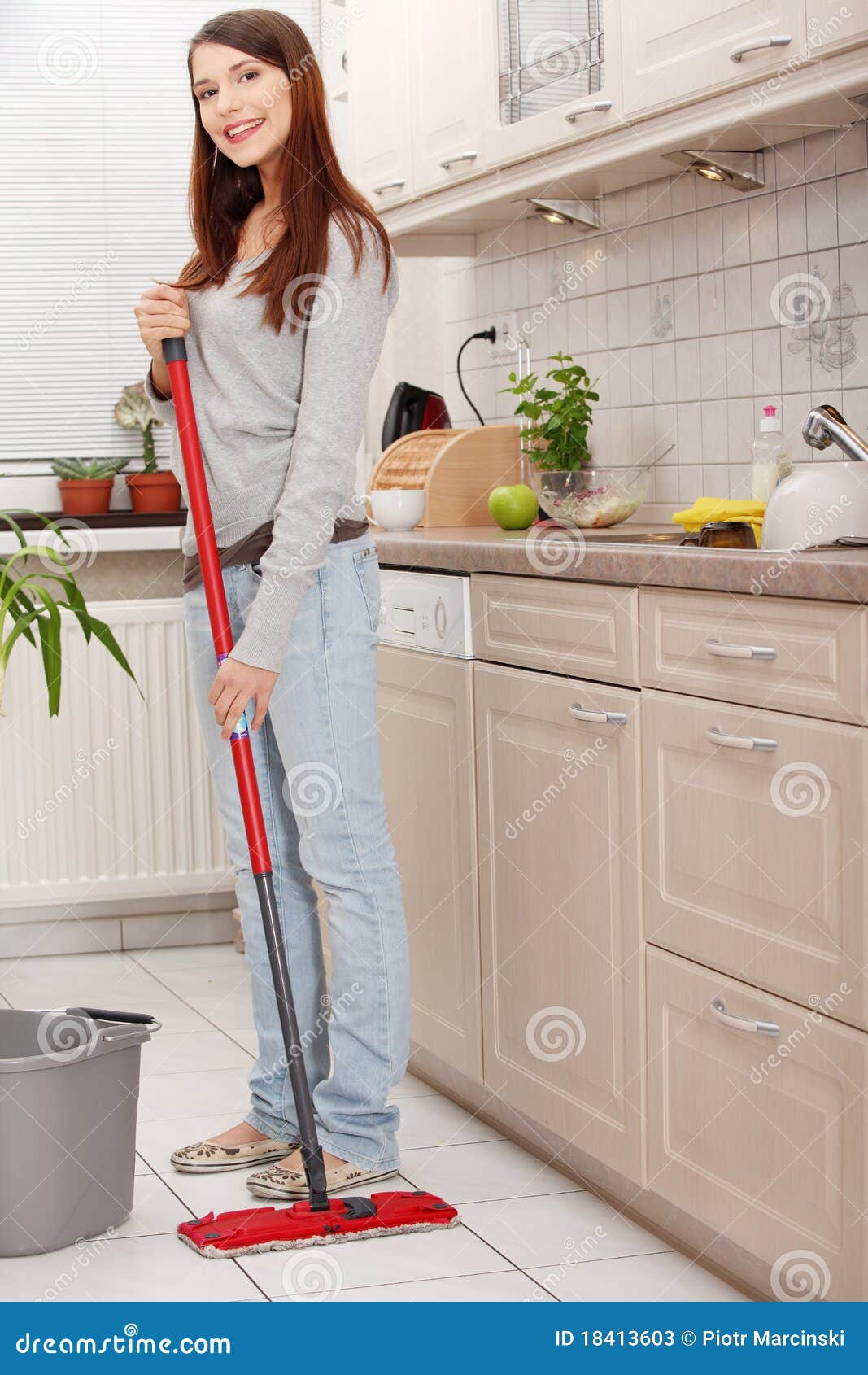 Woman holding a mop stock image. Image of female, cheerful - 18413603