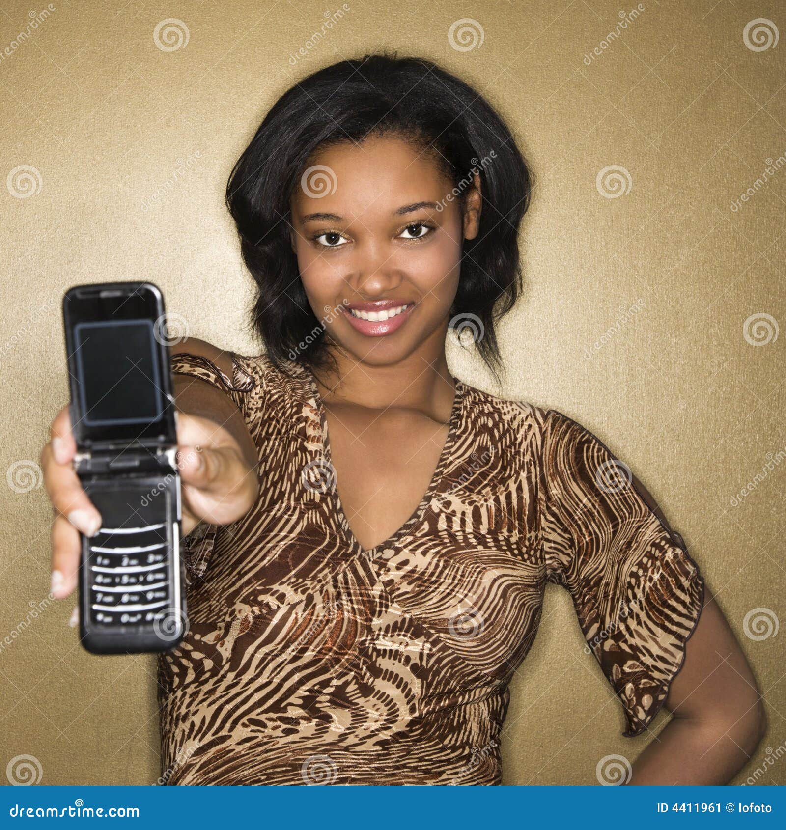 Woman Holding Out Cellphone. Stock Image - Image of smiling, indoors ...