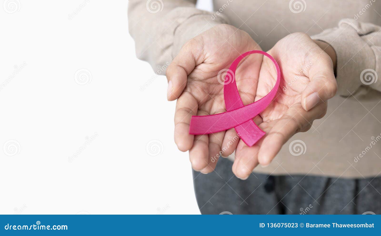 Woman Holding Pink Ribbon Supporting Symbol Of Breast Cancer Awareness