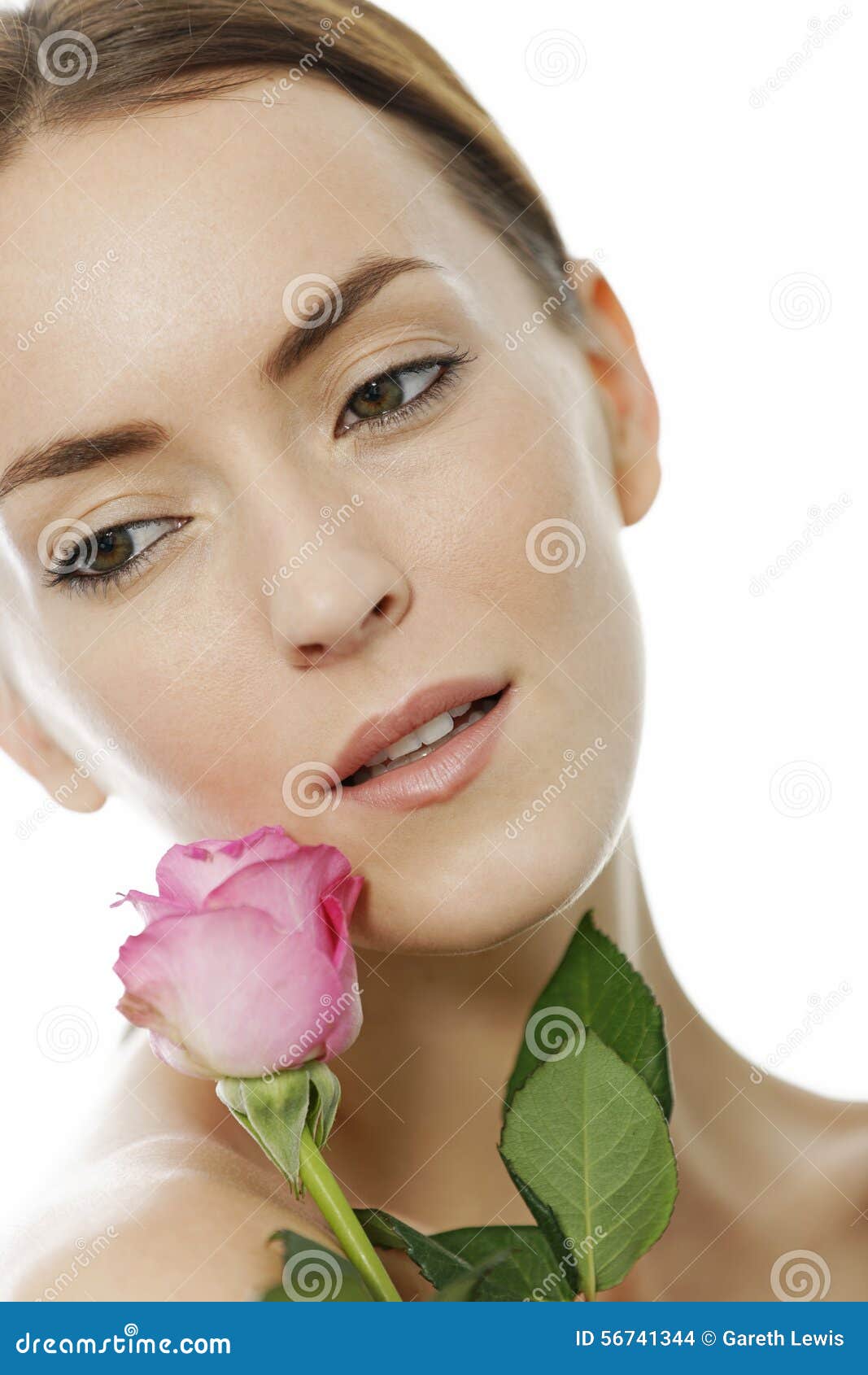 Woman holding a pink rose stock photo. Image of natural - 56741344
