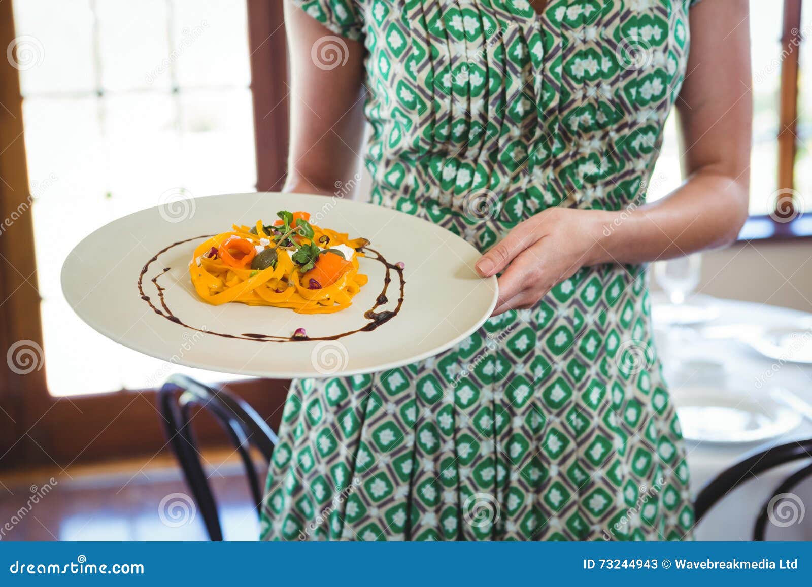 Woman holding a plate stock image. Image of elegant, standing - 73244943