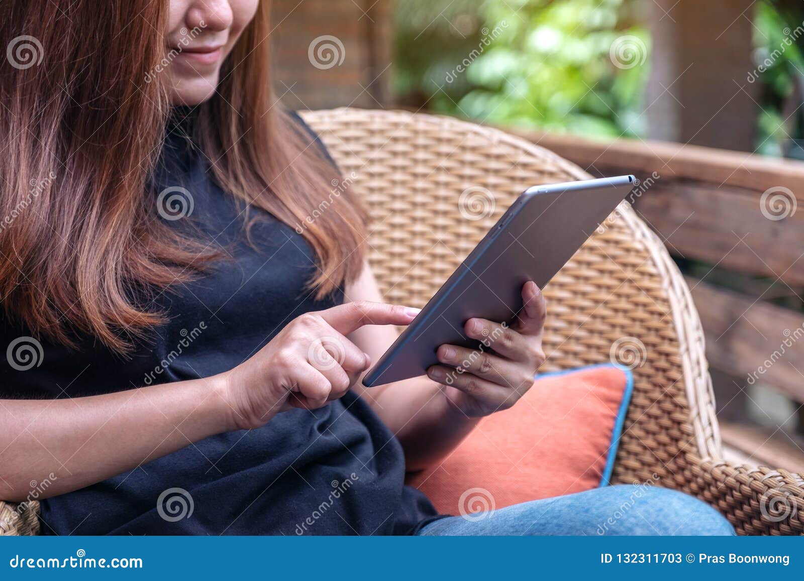 A Woman Holding and Pointing at Tablet Pc in the Outdoors Stock Image ...