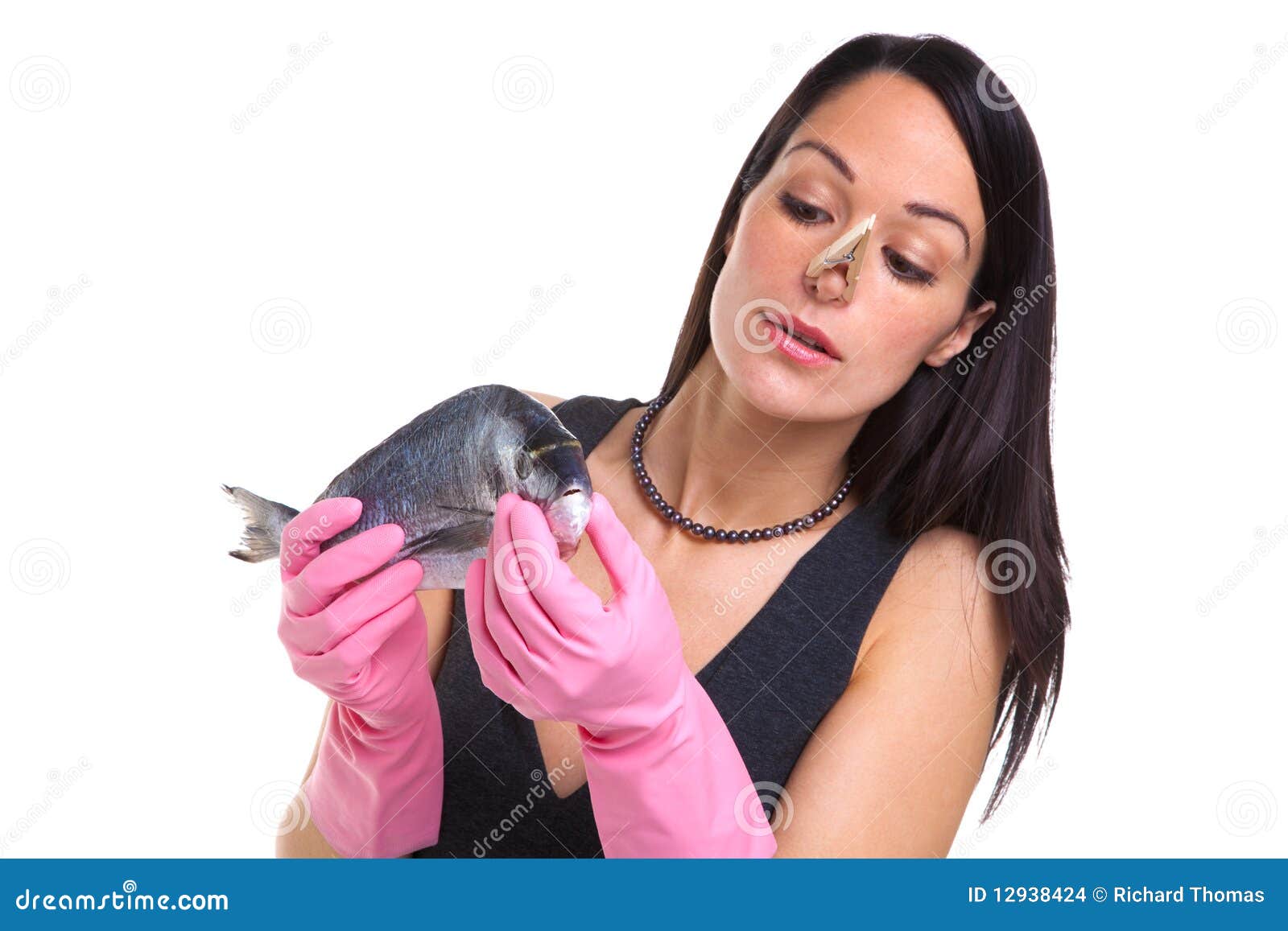 Woman holding a raw fish stock photo. Image of horrible - 12938424