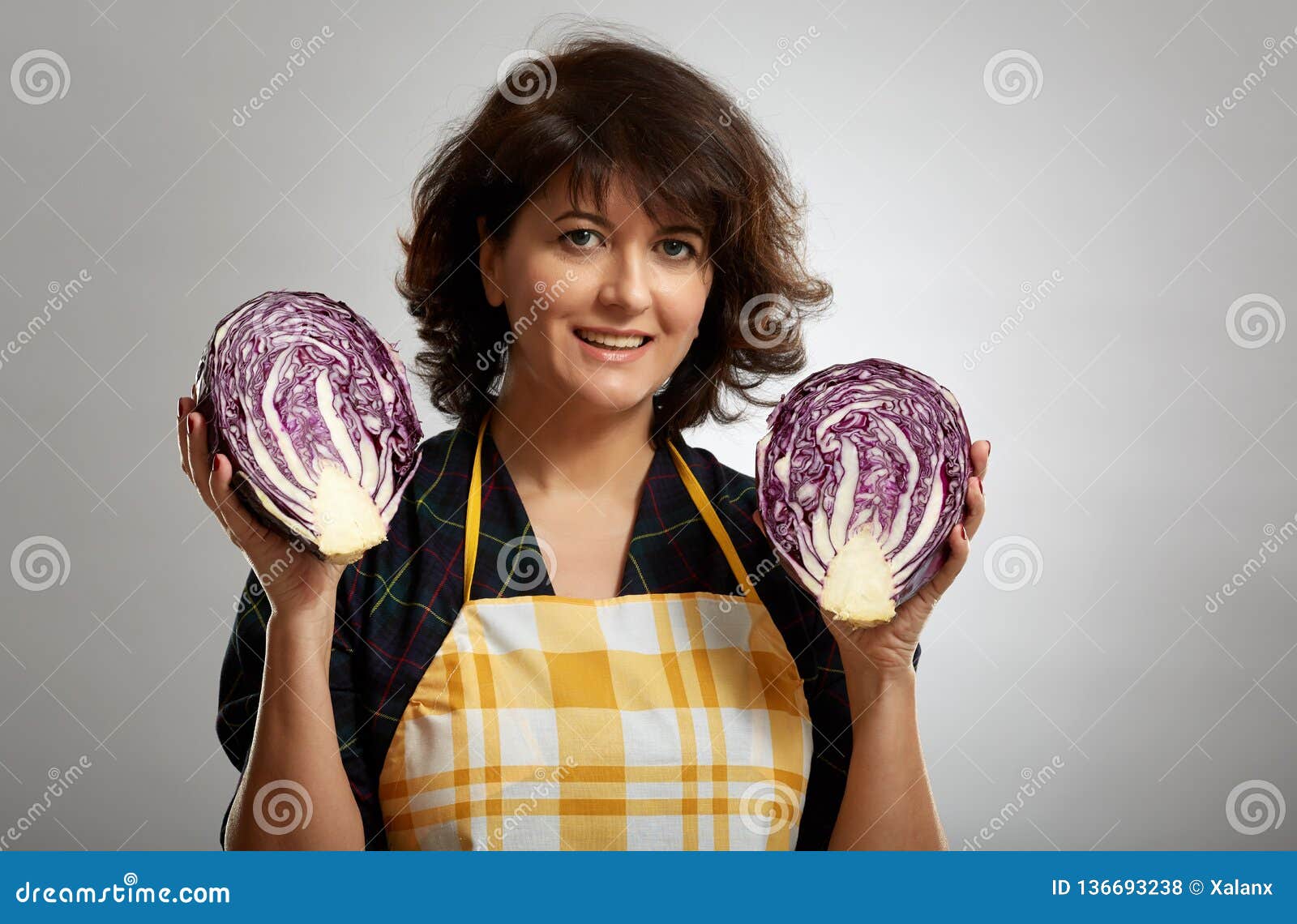 Woman holding red cabbage stock photo. Image of kitchen - 136693238