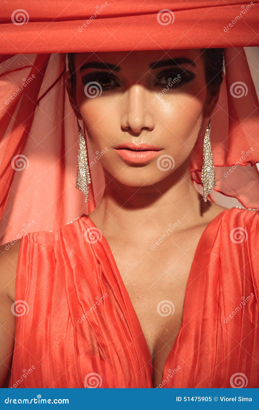 Woman Holding A Red Scarf Over Her Head Stock Image Image Of