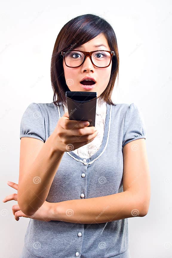 Woman Holding Remote Control Stock Image - Image of expression ...