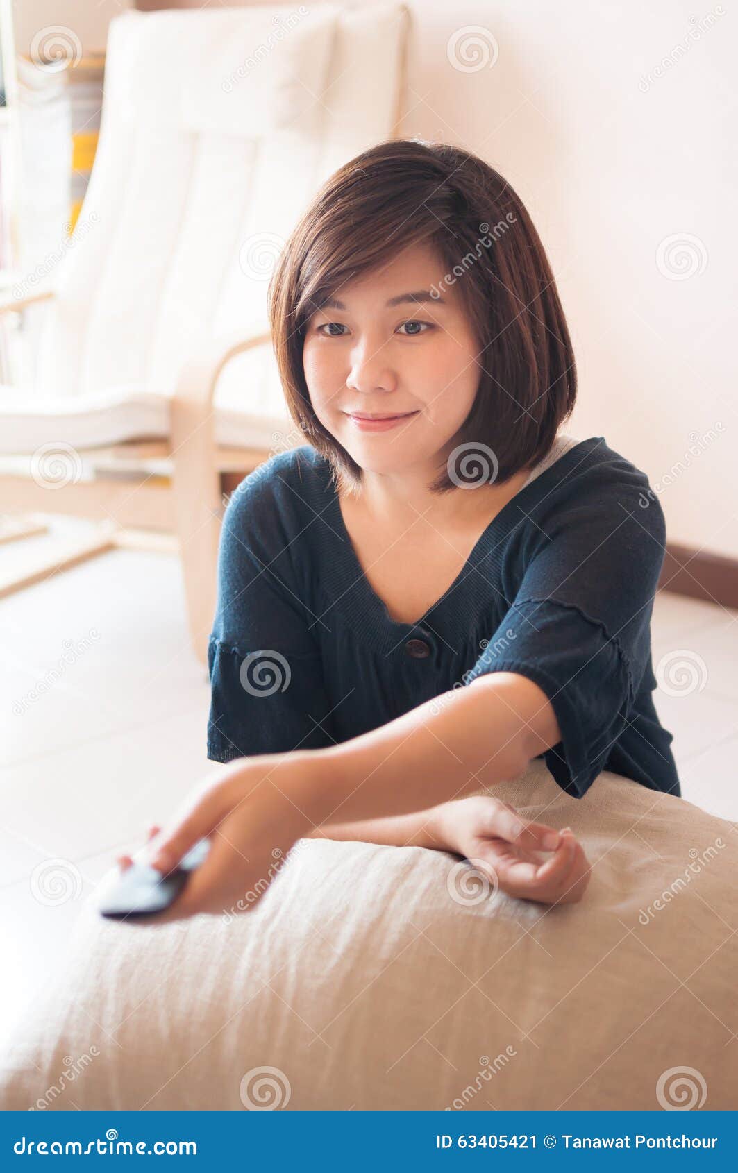Woman Holding Remote Control with Smiling Face. Stock Image - Image of ...