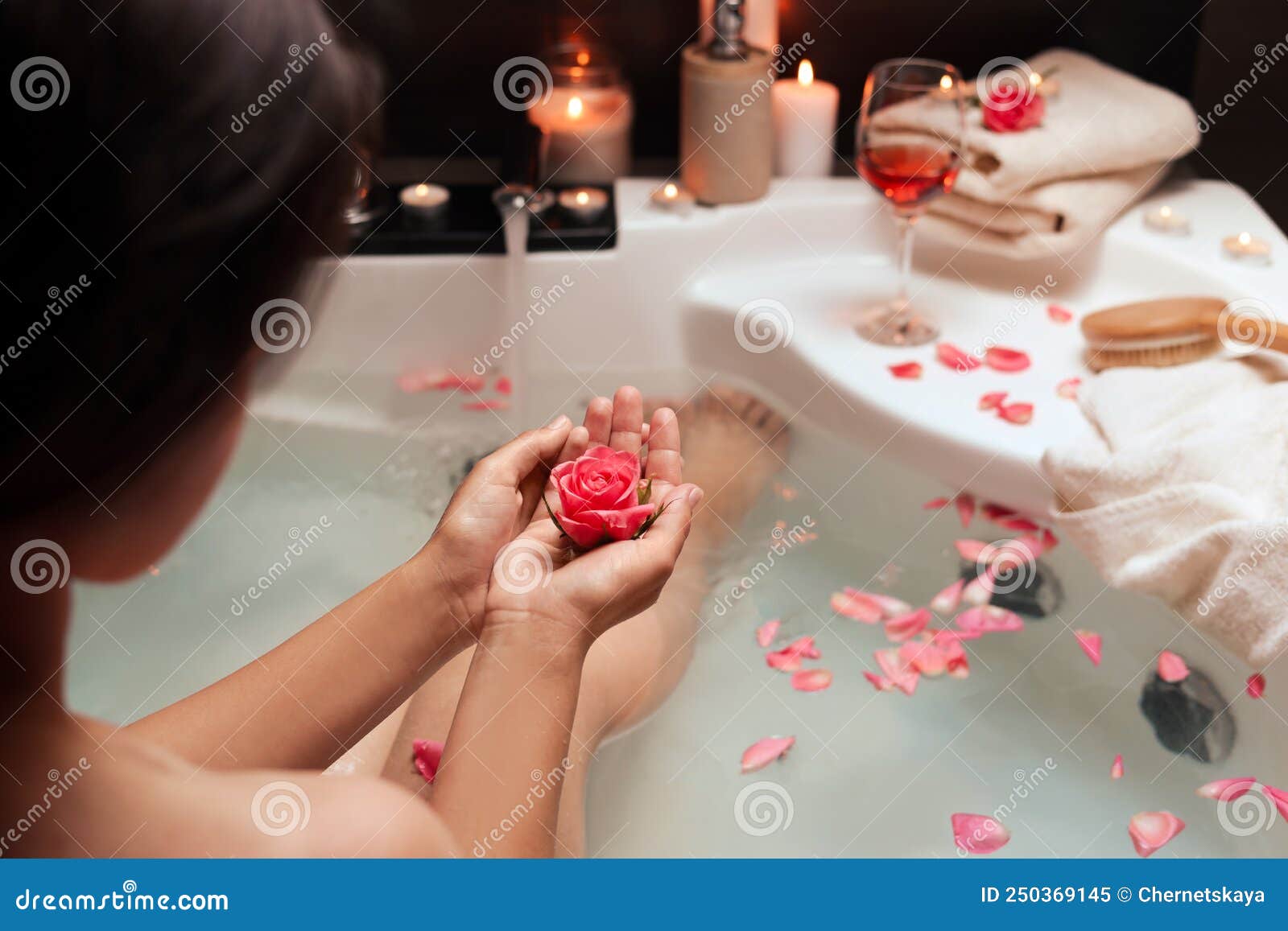 Woman Holding Rose Flower While Taking Bath Closeup Romantic