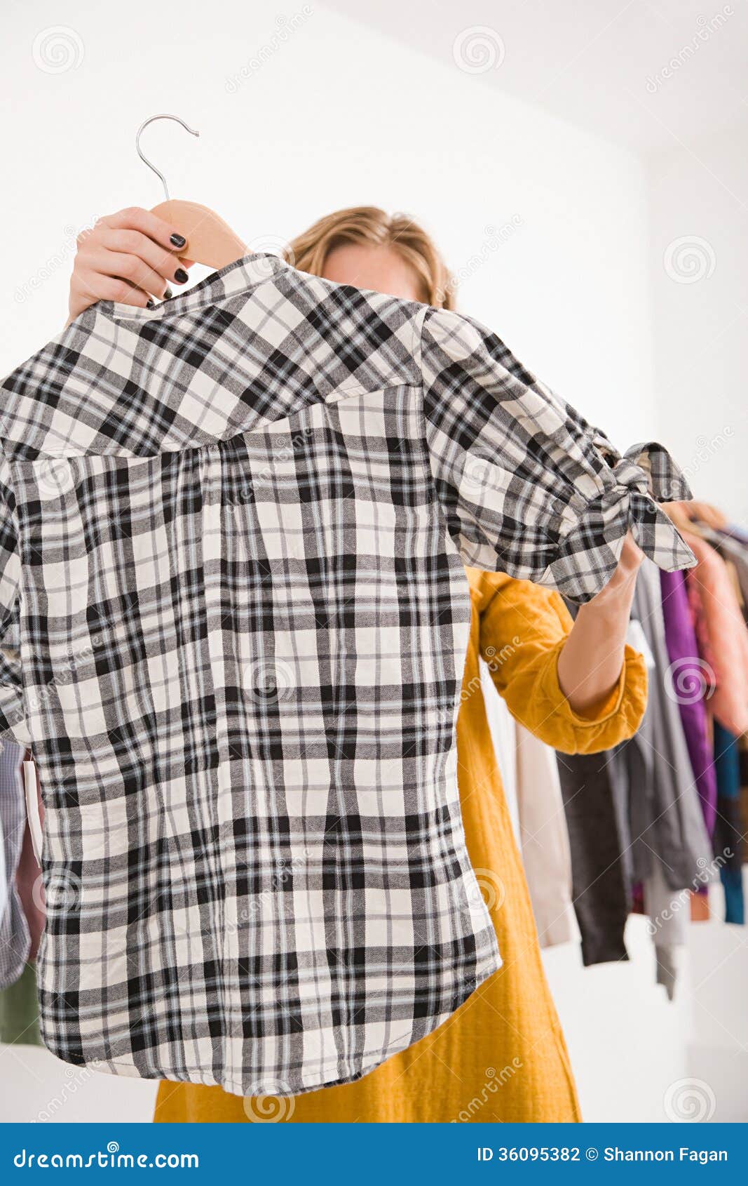 Woman holding a shirt stock photo. Image of female, checker - 36095382