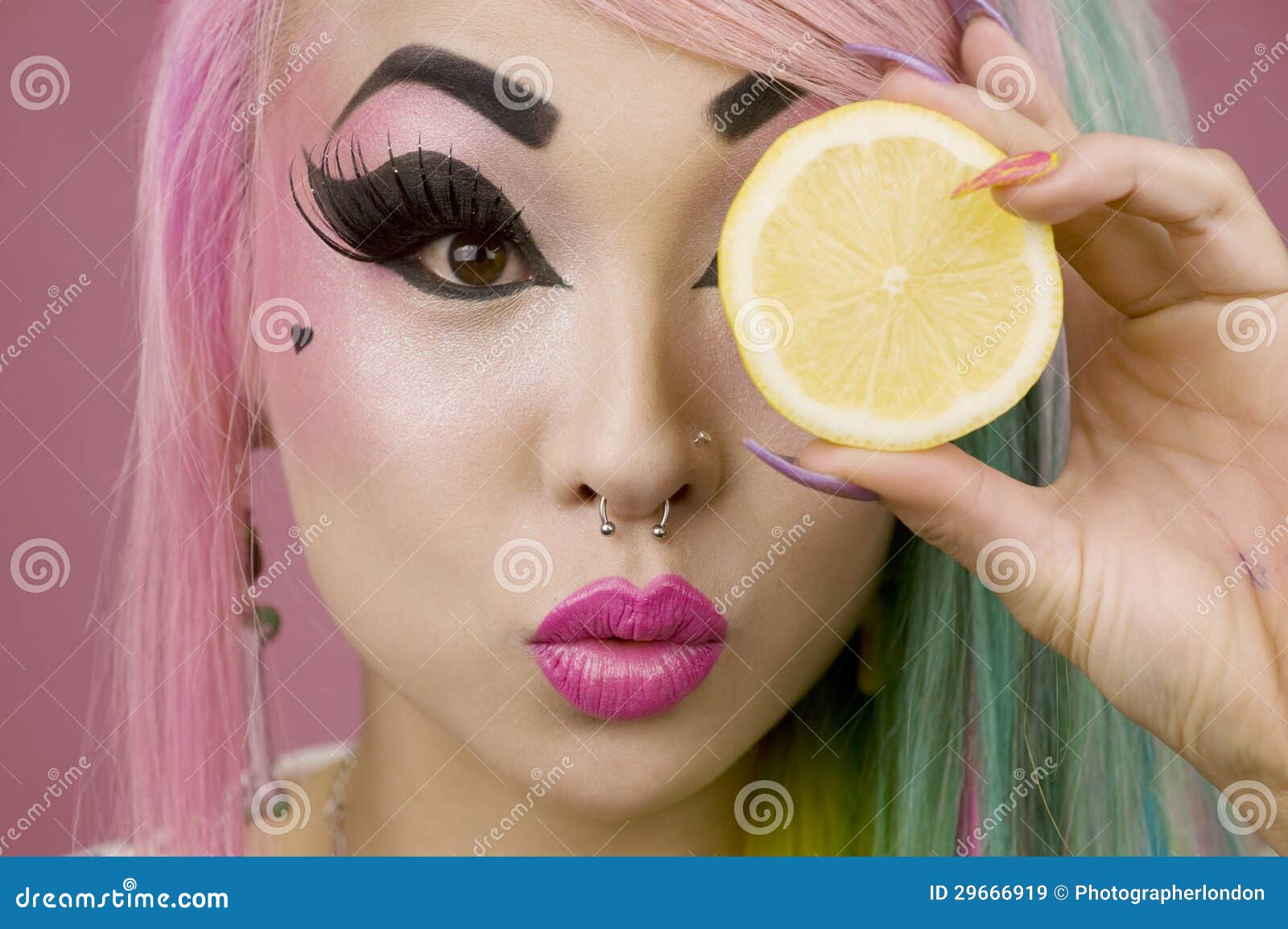 Woman Holding Slice of Lemon in Front of Her Eyes Stock Image - Image ...